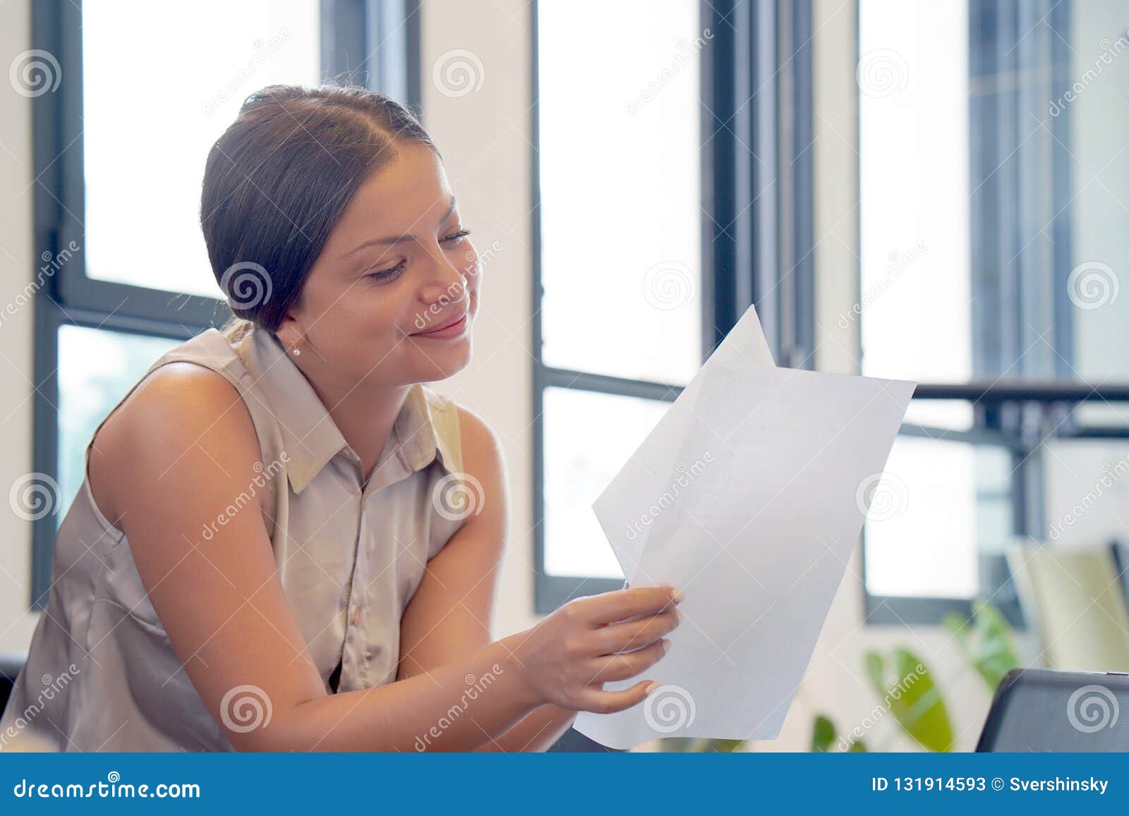 Business Woman Reading a Document in Office Workspace Stock Image ...