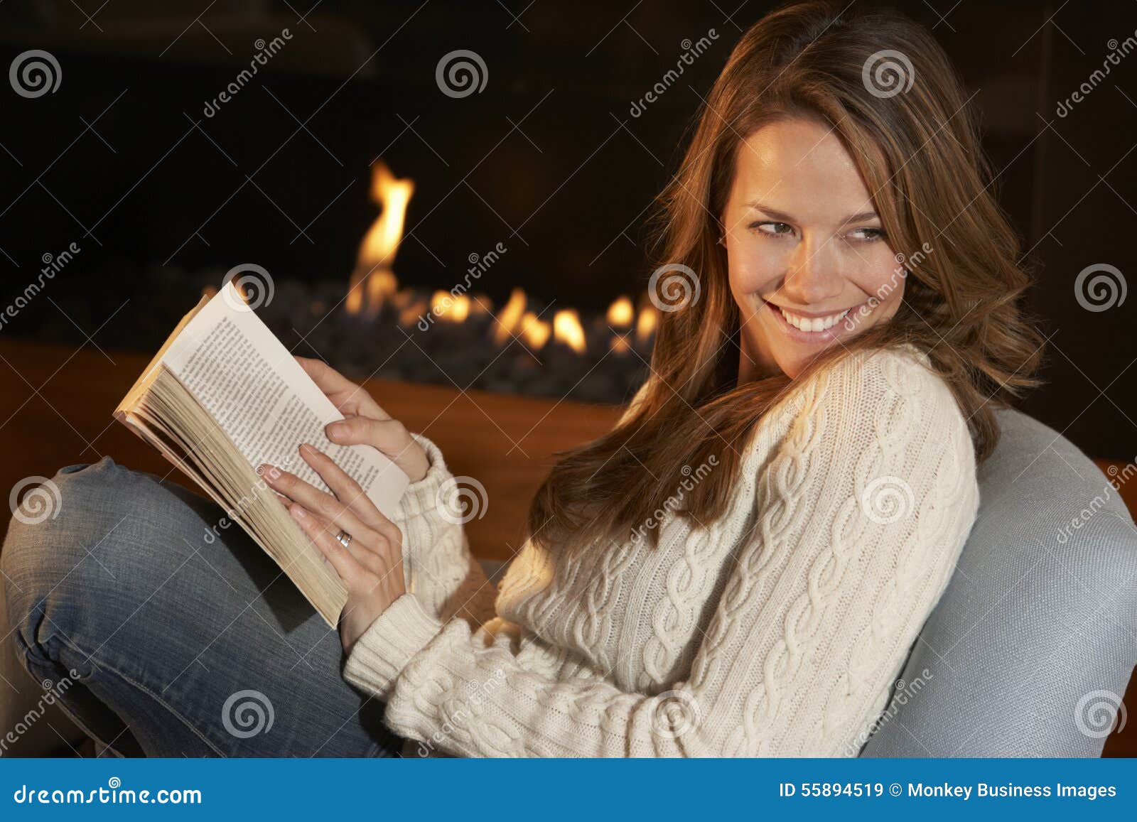 Woman Reading in Front of Fire at Home Stock Image - Image of fire ...