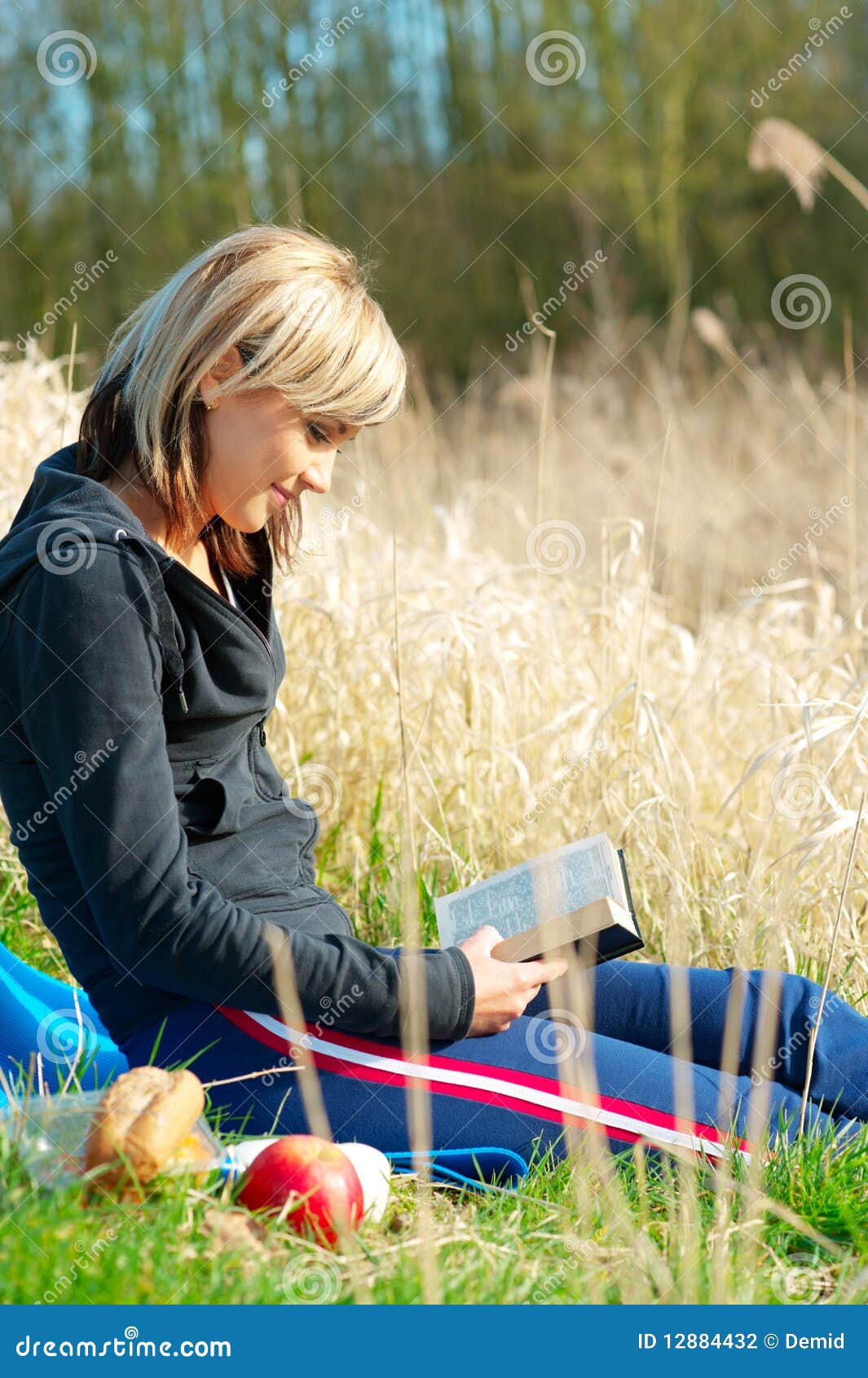 Woman Reading on Grass stock photo. Image of caucasian - 12884432