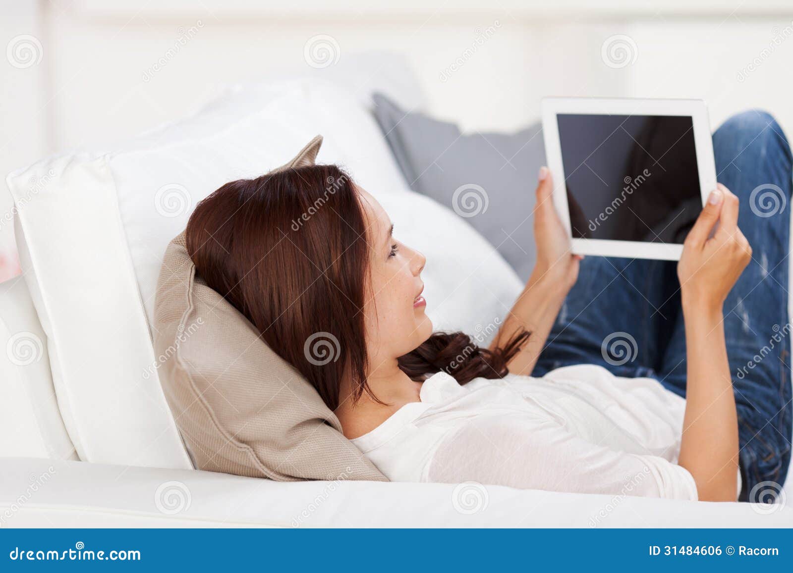 Woman Reading Her Tablet-pc Stock Photo - Image of holding, couch: 31484606