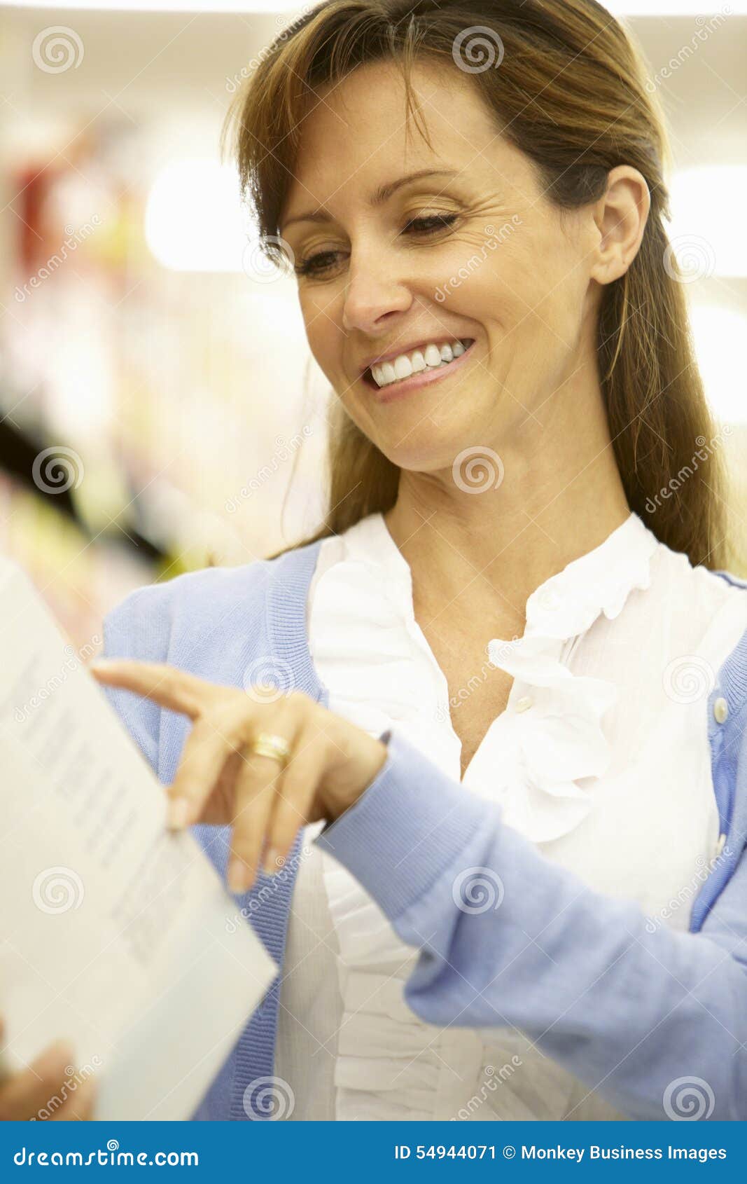 Woman Reading Ingredients on Packet in Supermarket Stock Image - Image ...