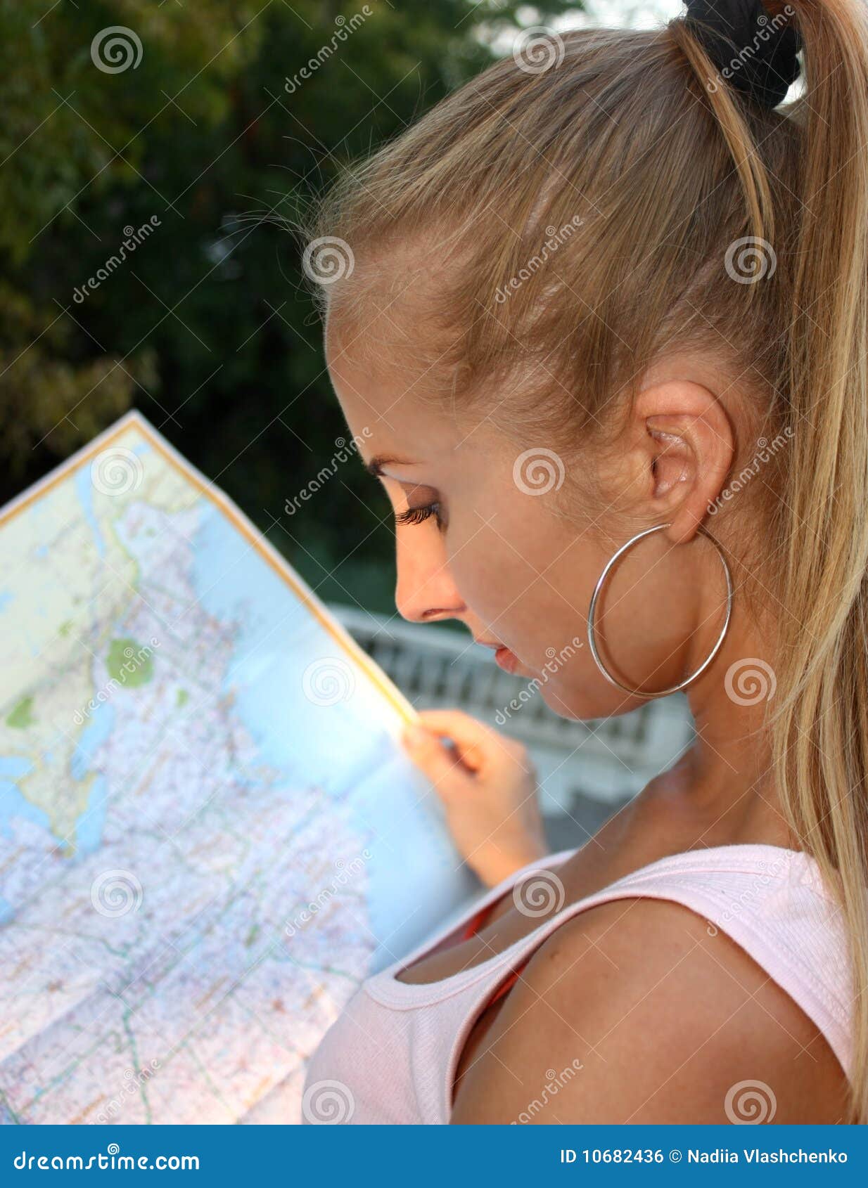 Woman reading a map stock photo. Image of pack, girl - 10682436