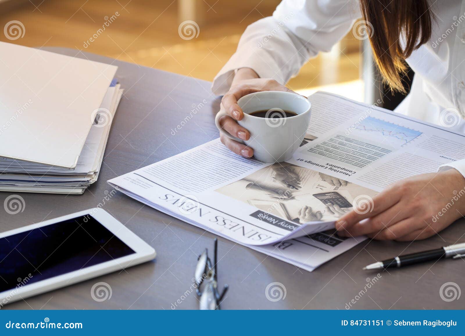 Woman Reading Newspaper on Table Stock Image - Image of coffee, drink ...