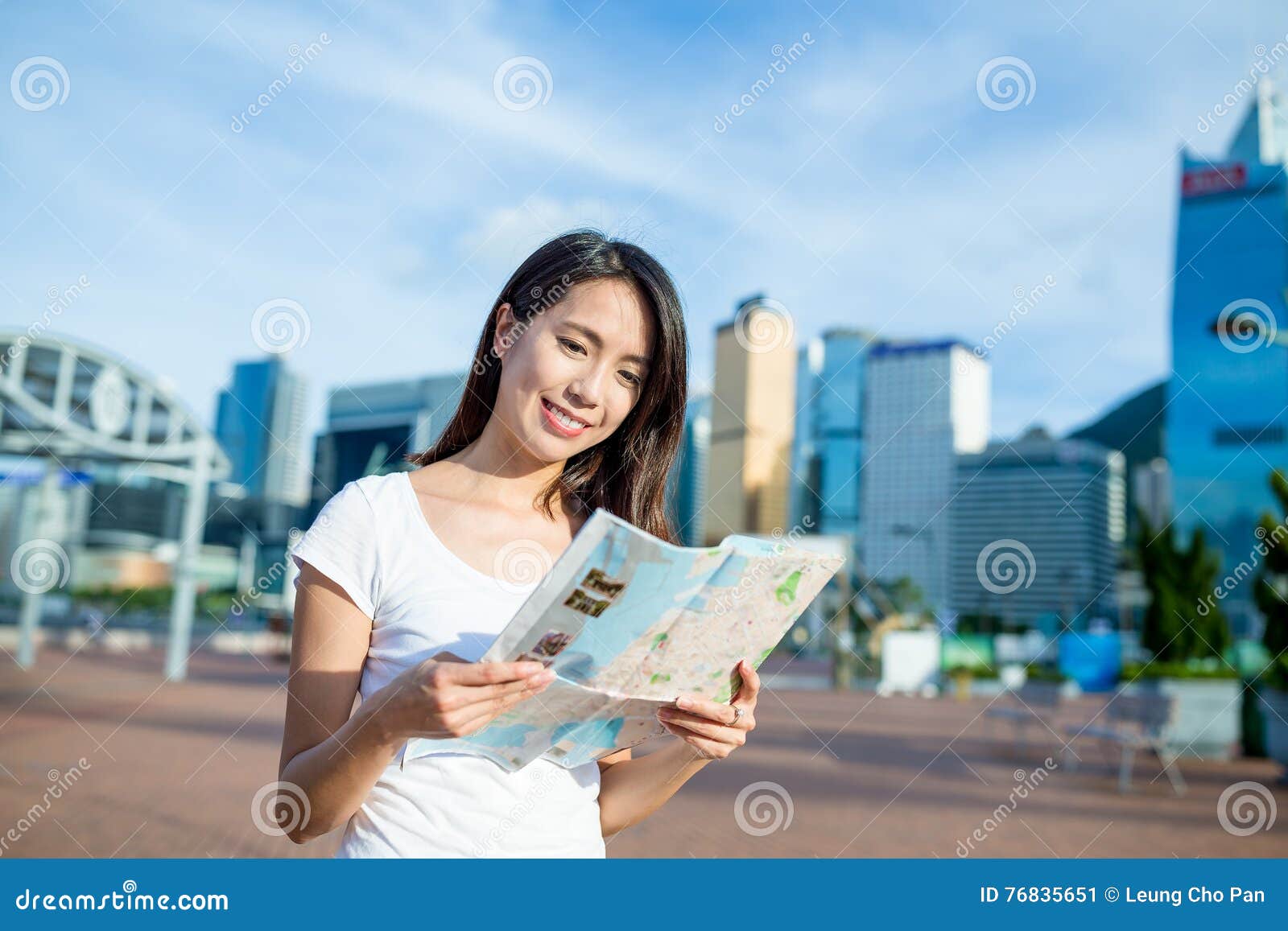 Woman reading on paper map stock image. Image of cityscape - 76835651