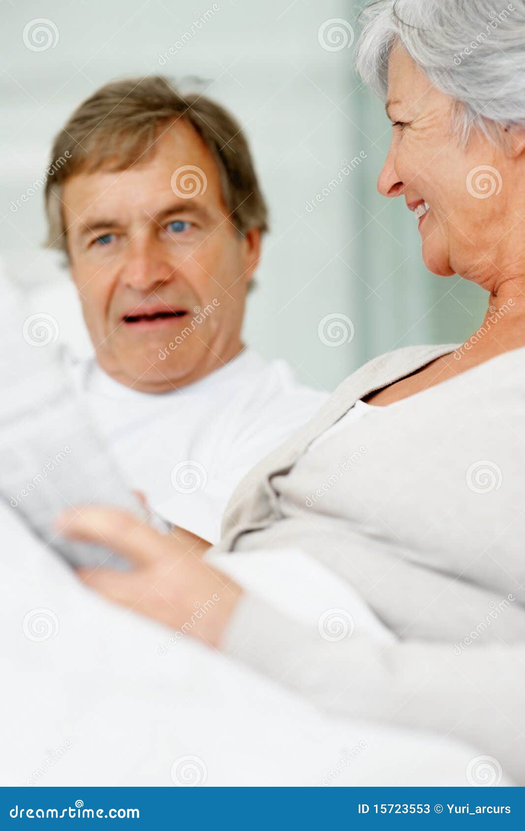 Woman Reading Something Interesting To Her Husband Stock Image - Image ...
