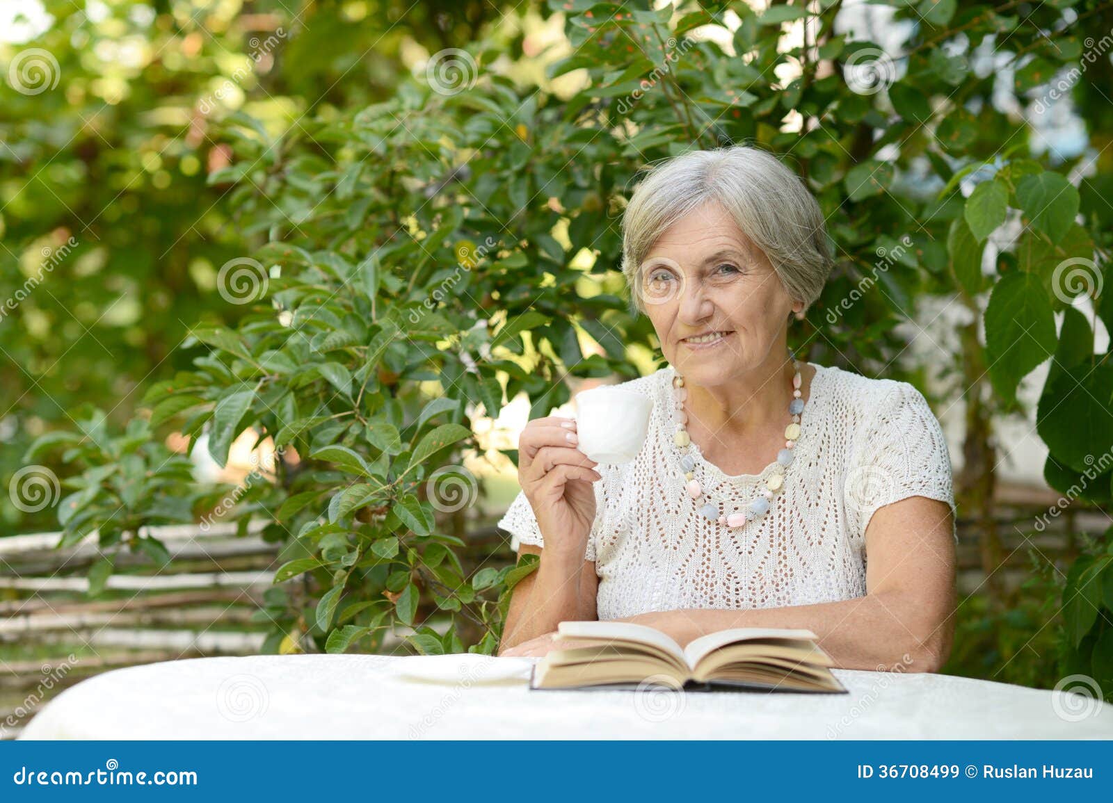 Woman reading at table stock image. Image of happy, gray - 36708499