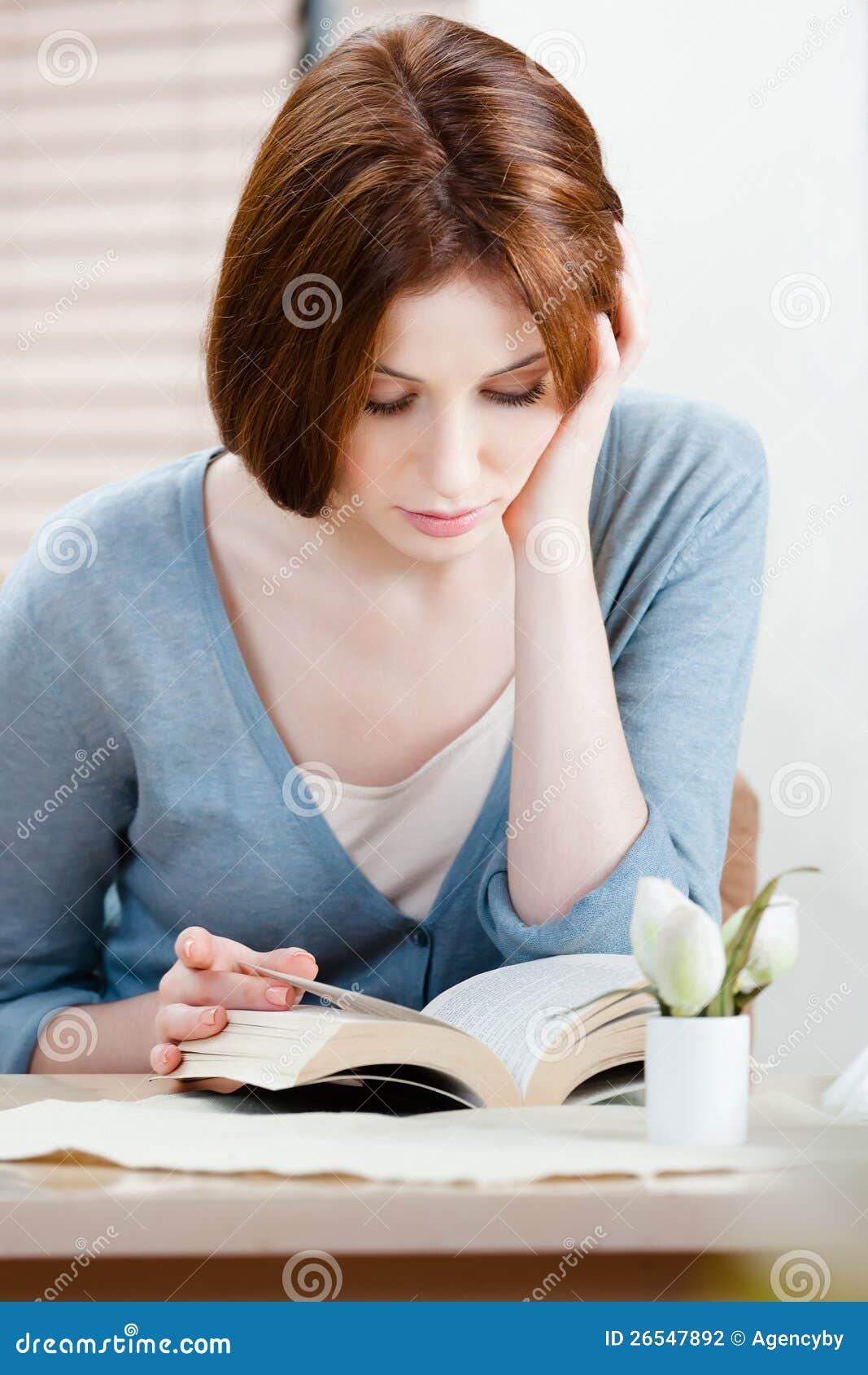 Woman Reads the Book at the Shop Stock Photo - Image of beautiful, face ...