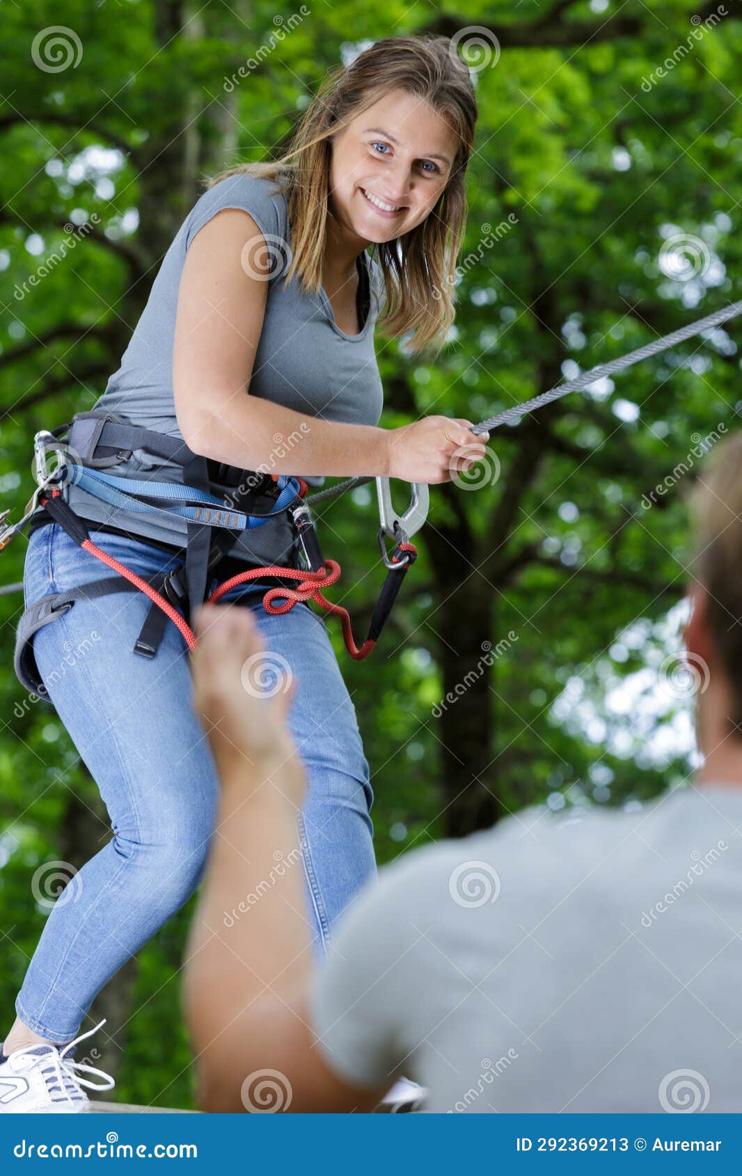 Woman ready to do zipline stock image. Image of hook - 292369213