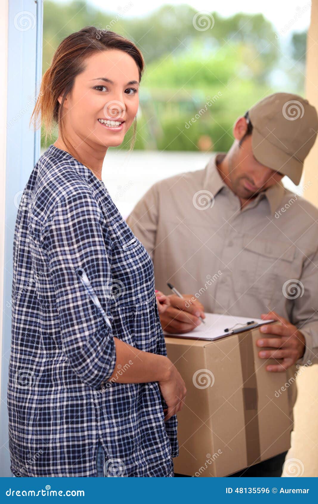 Woman receiving package stock photo. Image of deliver - 48135596