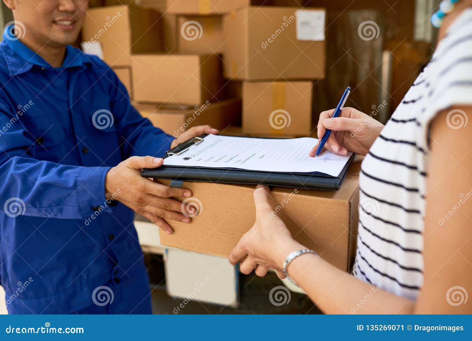 Woman receiving package stock image. Image of accepting - 135269071