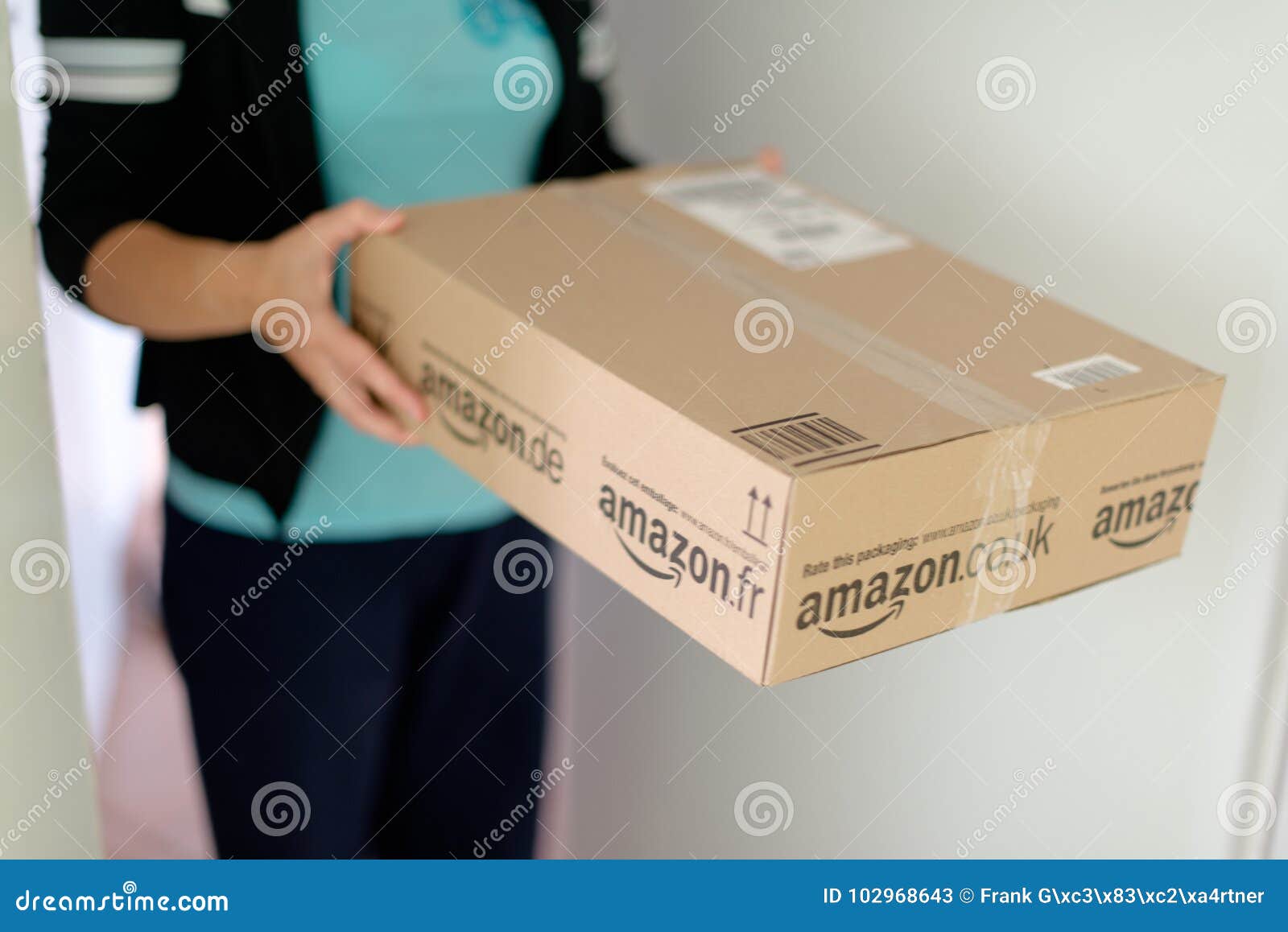 Woman receiving parcel editorial stock photo. Image of friendly - 102968643