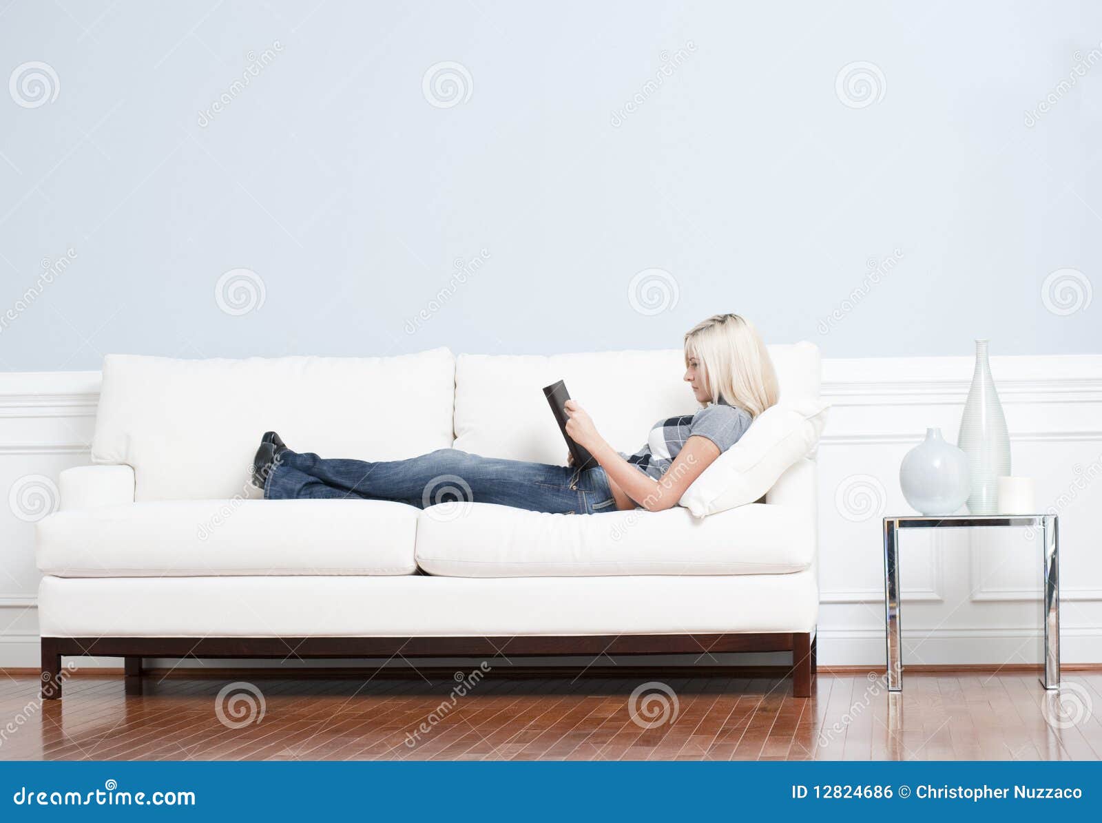 Woman Reclining In Swimsuit On Beach At Sunset Royalty-Free Stock Photo ...