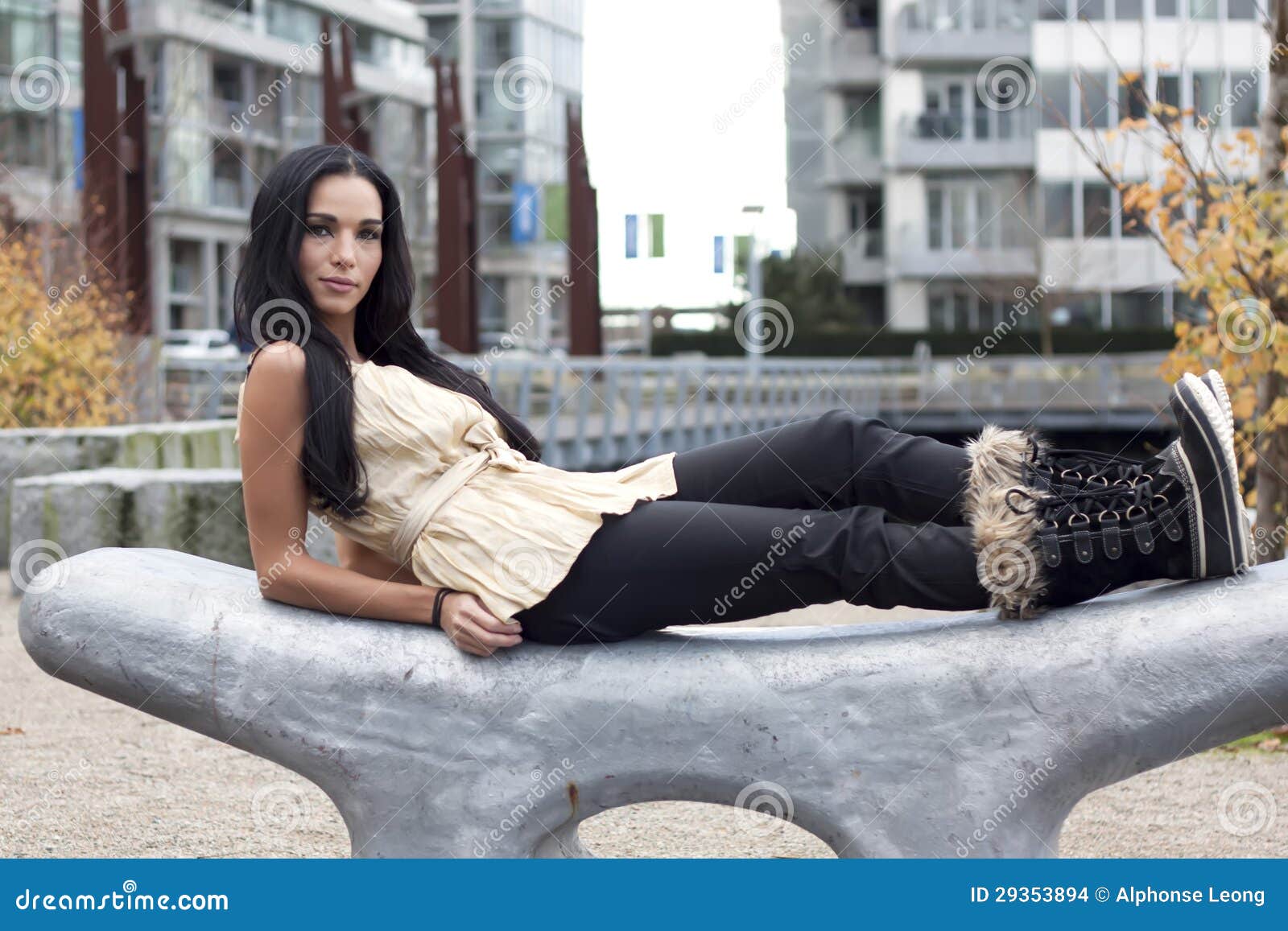 Woman Reclining on Curvy Stone Bench Stock Photo - Image of female ...