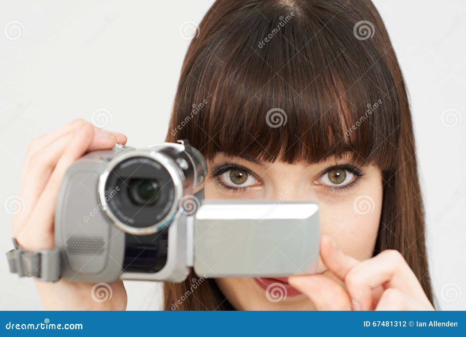 Woman Recording on Portable Video Camera Stock Photo - Image of indoors ...
