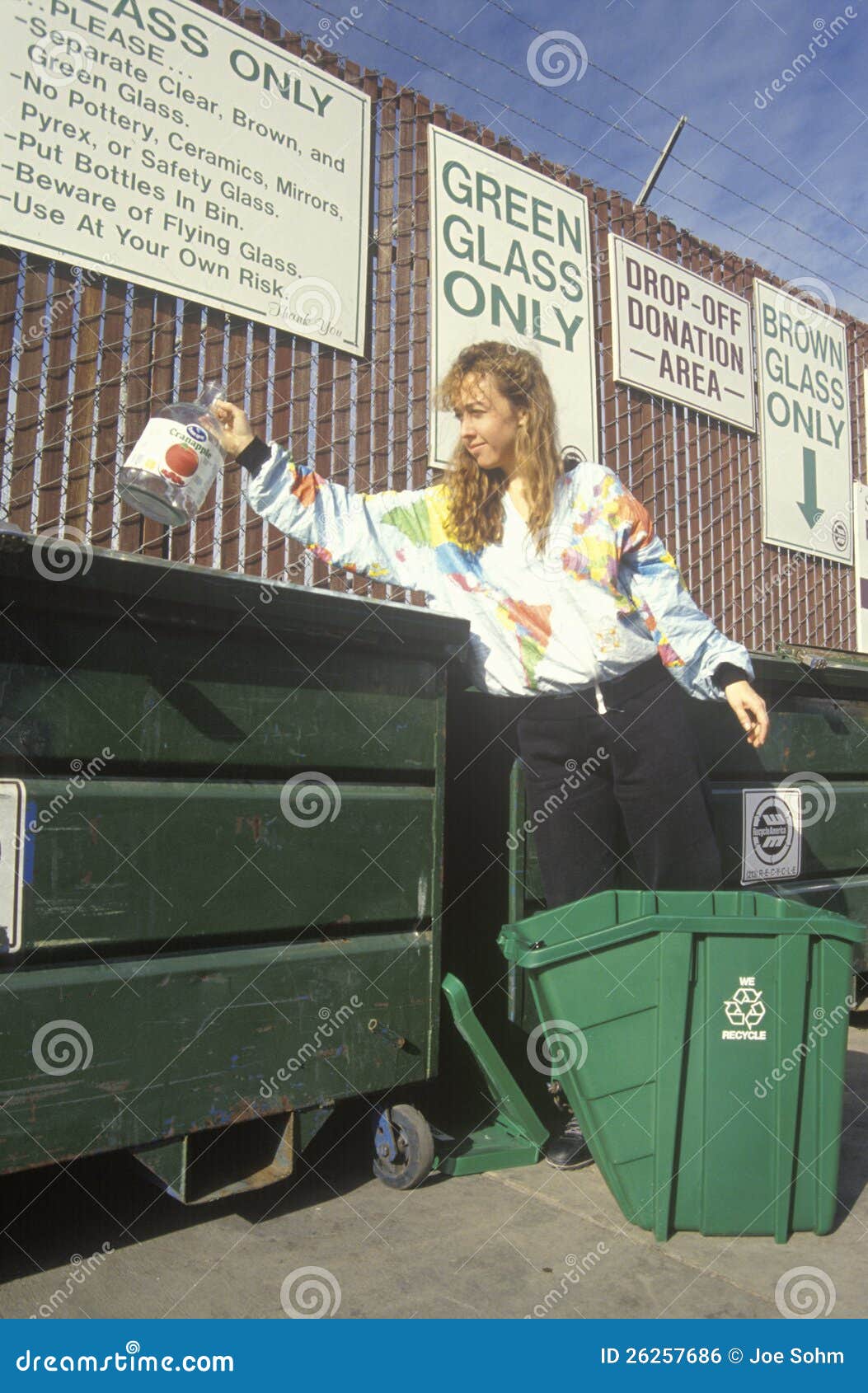 A woman recycling plastics editorial photo. Image of environmental ...