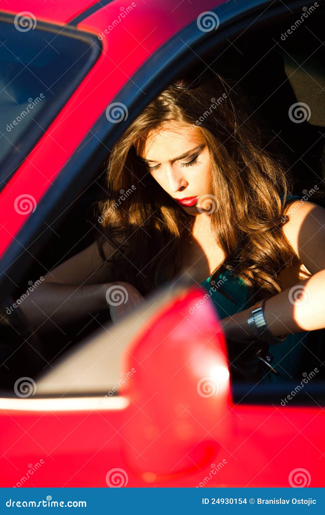 Woman in red car stock photo. Image of sunlit, young - 24930154
