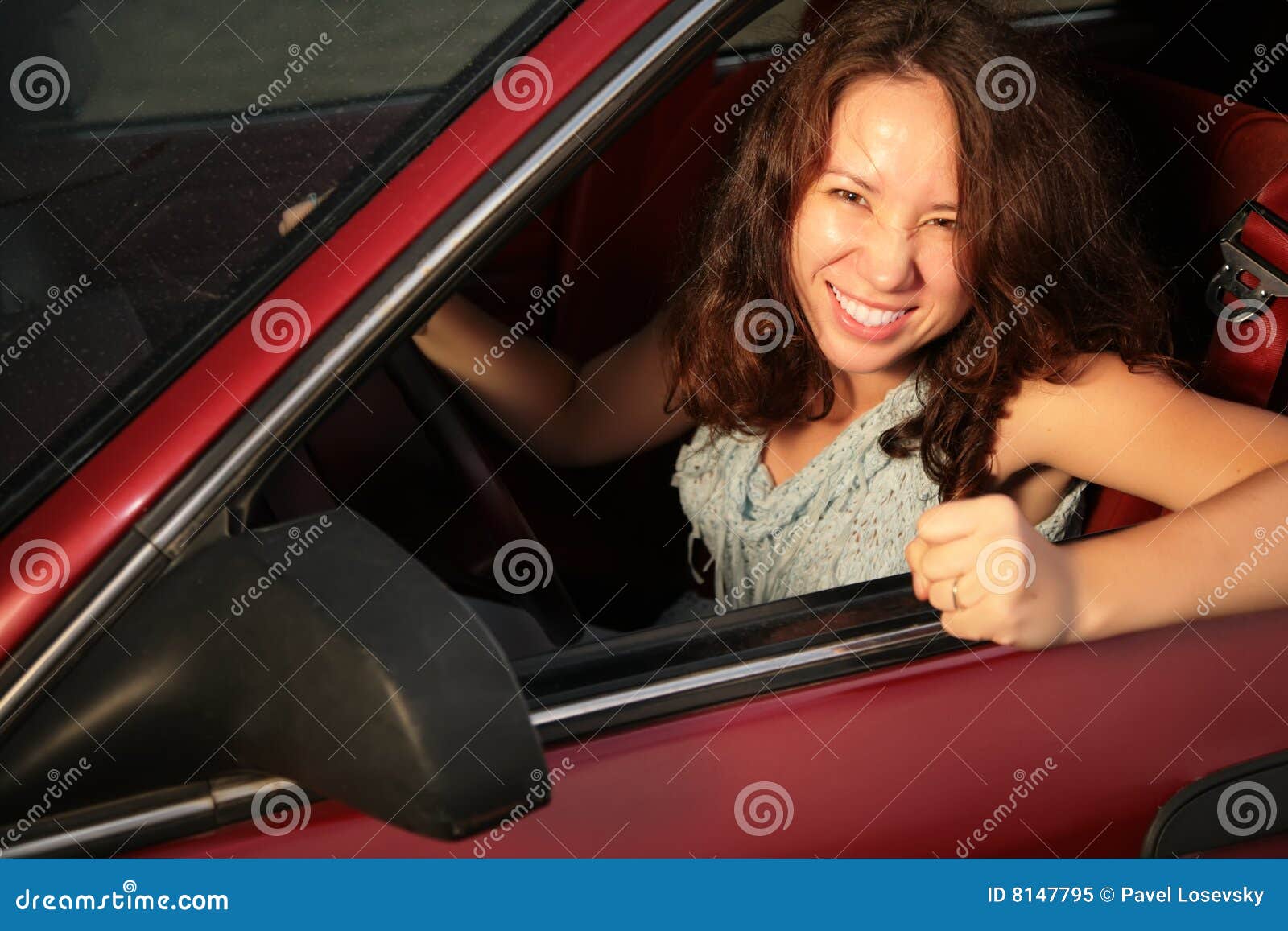Woman in the red car stock image. Image of fist, brown - 8147795
