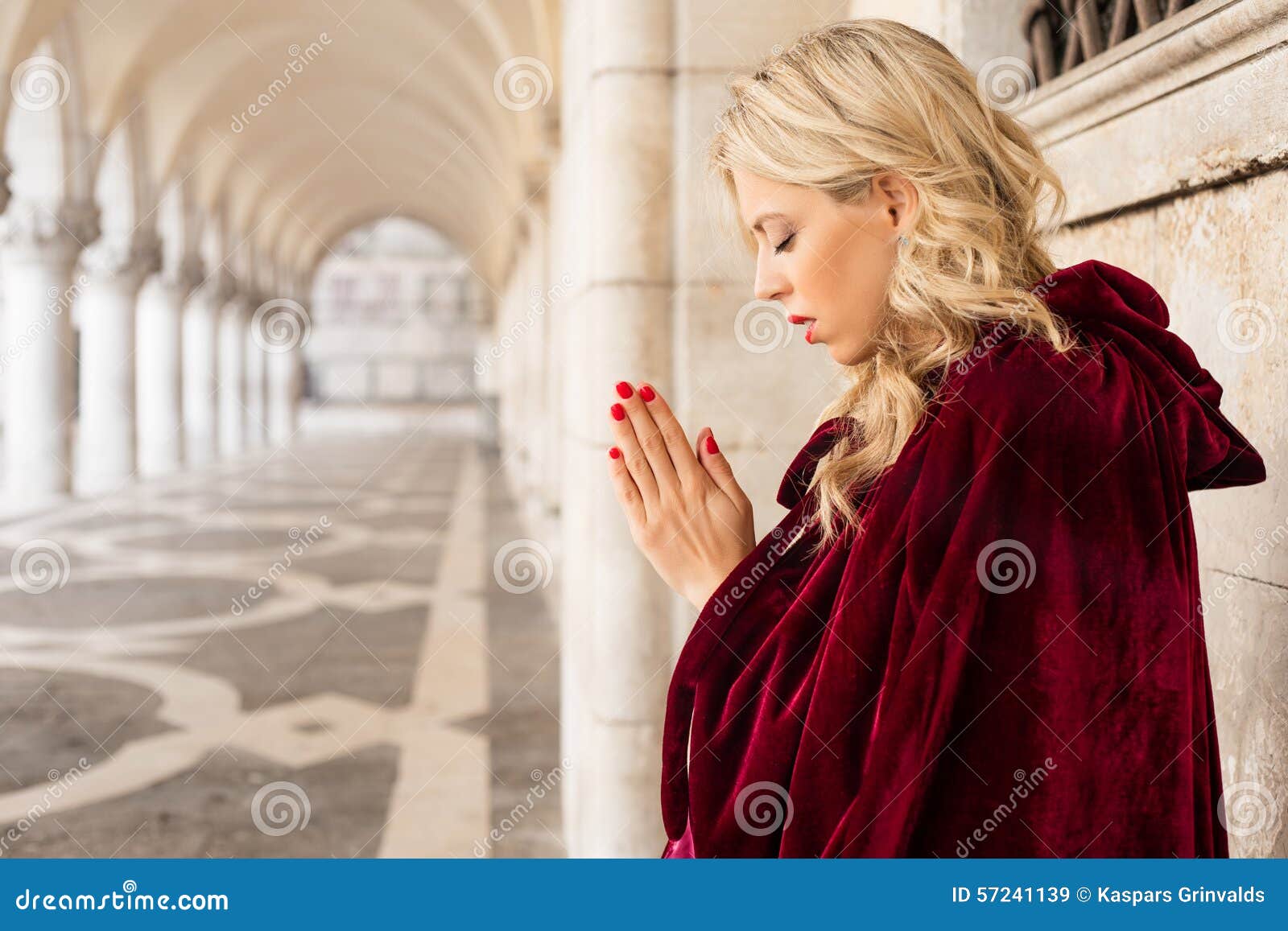 Woman in red cloak praying stock image. Image of mysterious - 57241139
