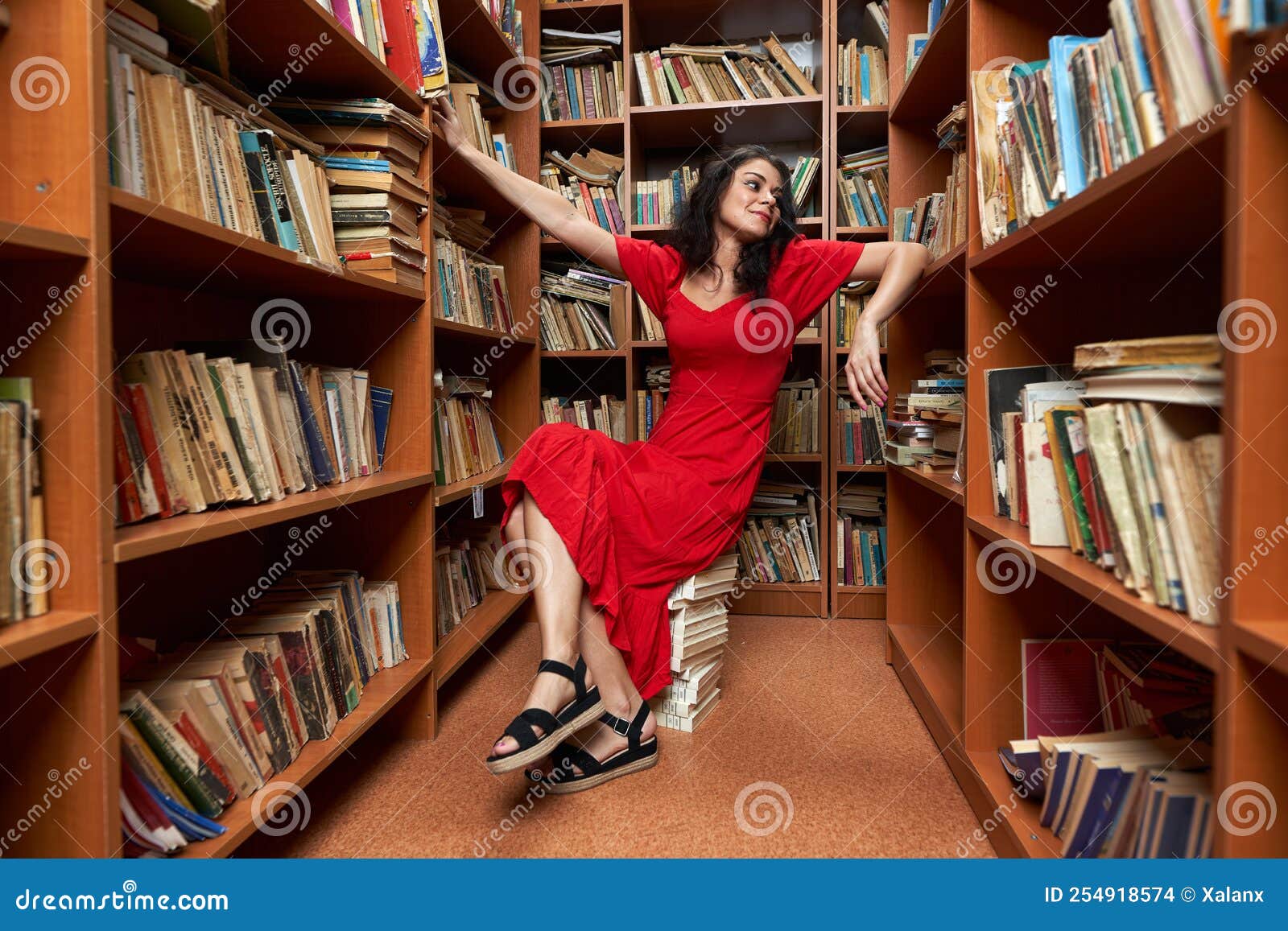 Woman in Red Dress in a Library Stock Photo - Image of information ...