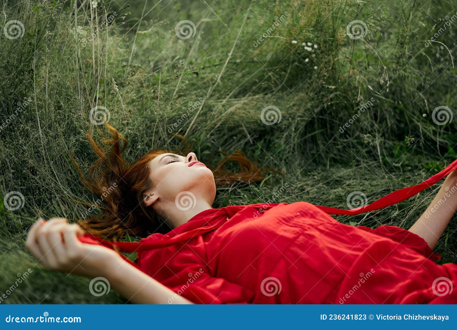 Woman In Red Dress Lying On The Grass Fresh Air Nature Romance Stock