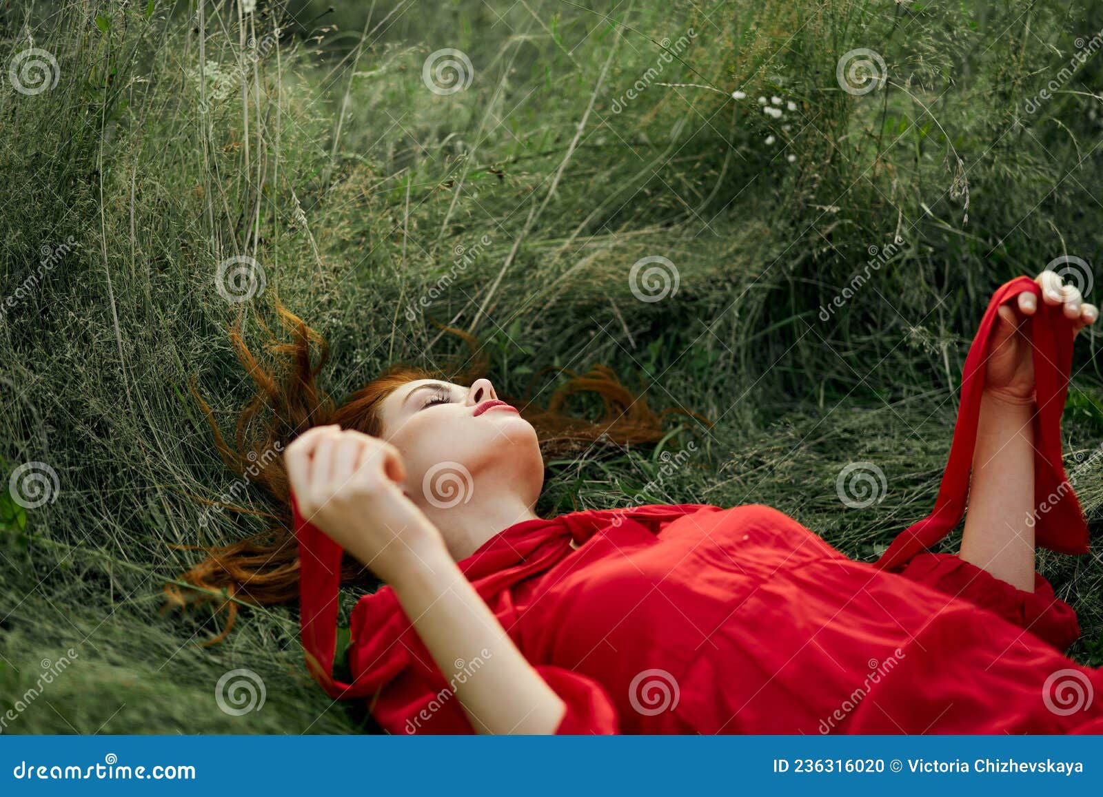 Woman In Red Dress Lying On The Grass Fresh Air Nature Romance Stock