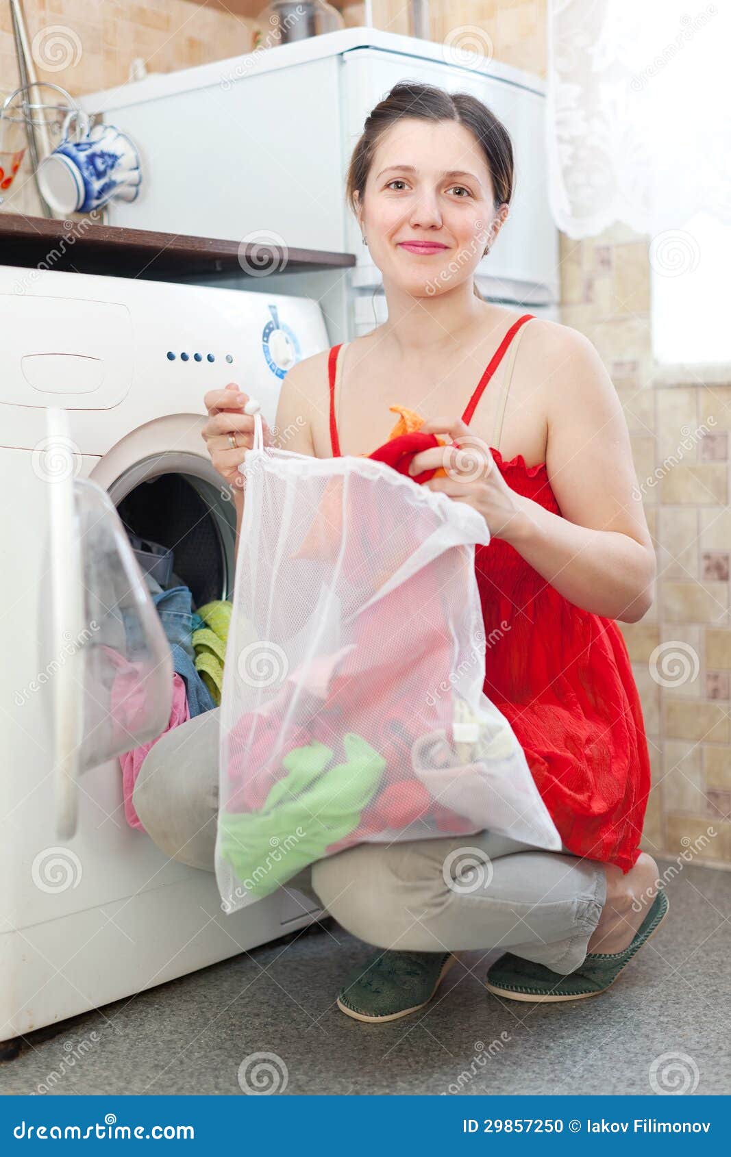Woman in Red Loading the Washing Machine Stock Photo - Image of human ...