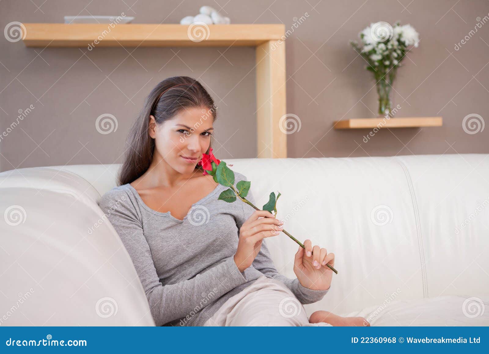 Woman with a Red Rose Sitting on the Sofa Stock Photo - Image of couch ...