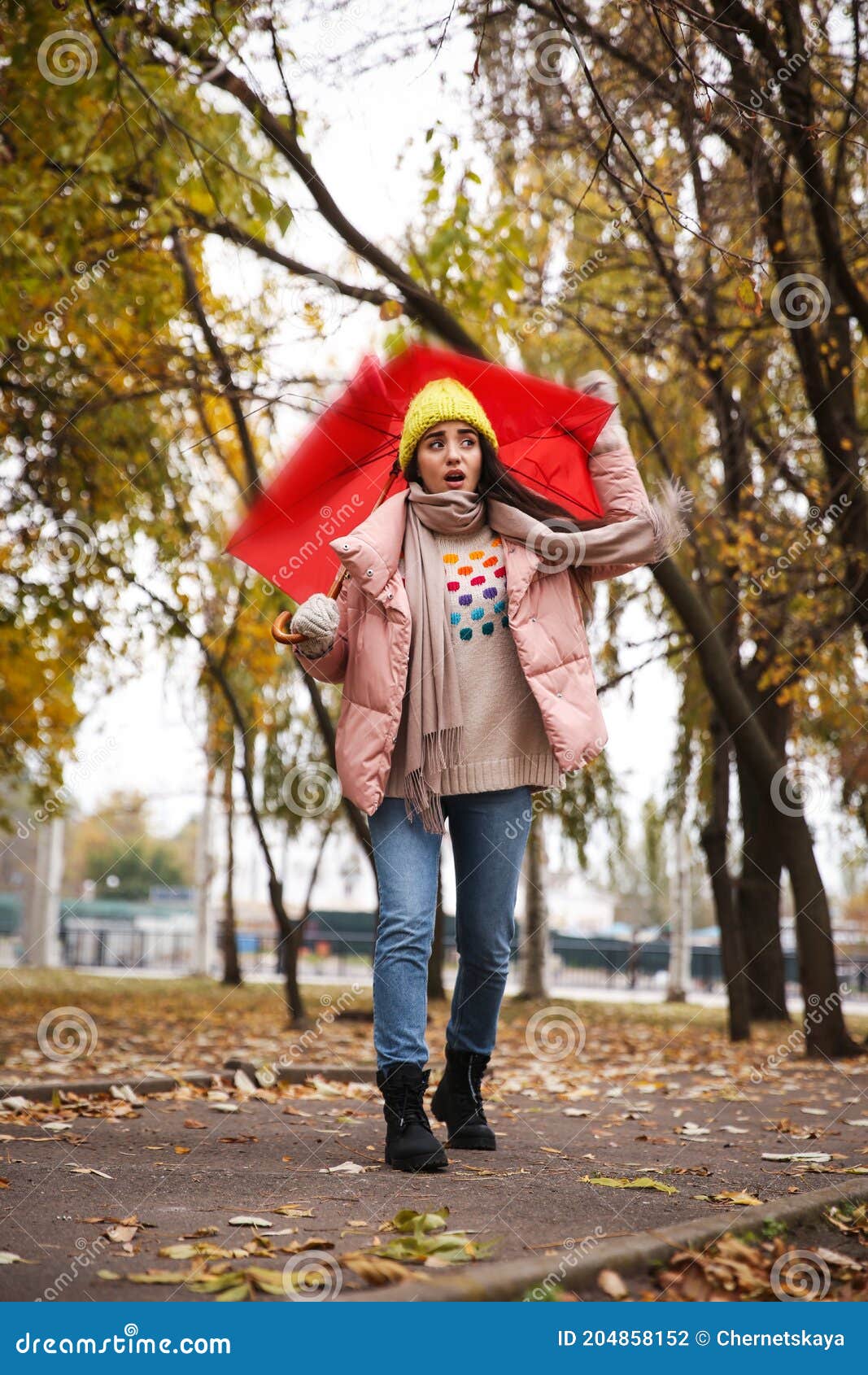 Woman with Red Umbrella Caught in Gust of Wind Outdoors Stock Photo ...