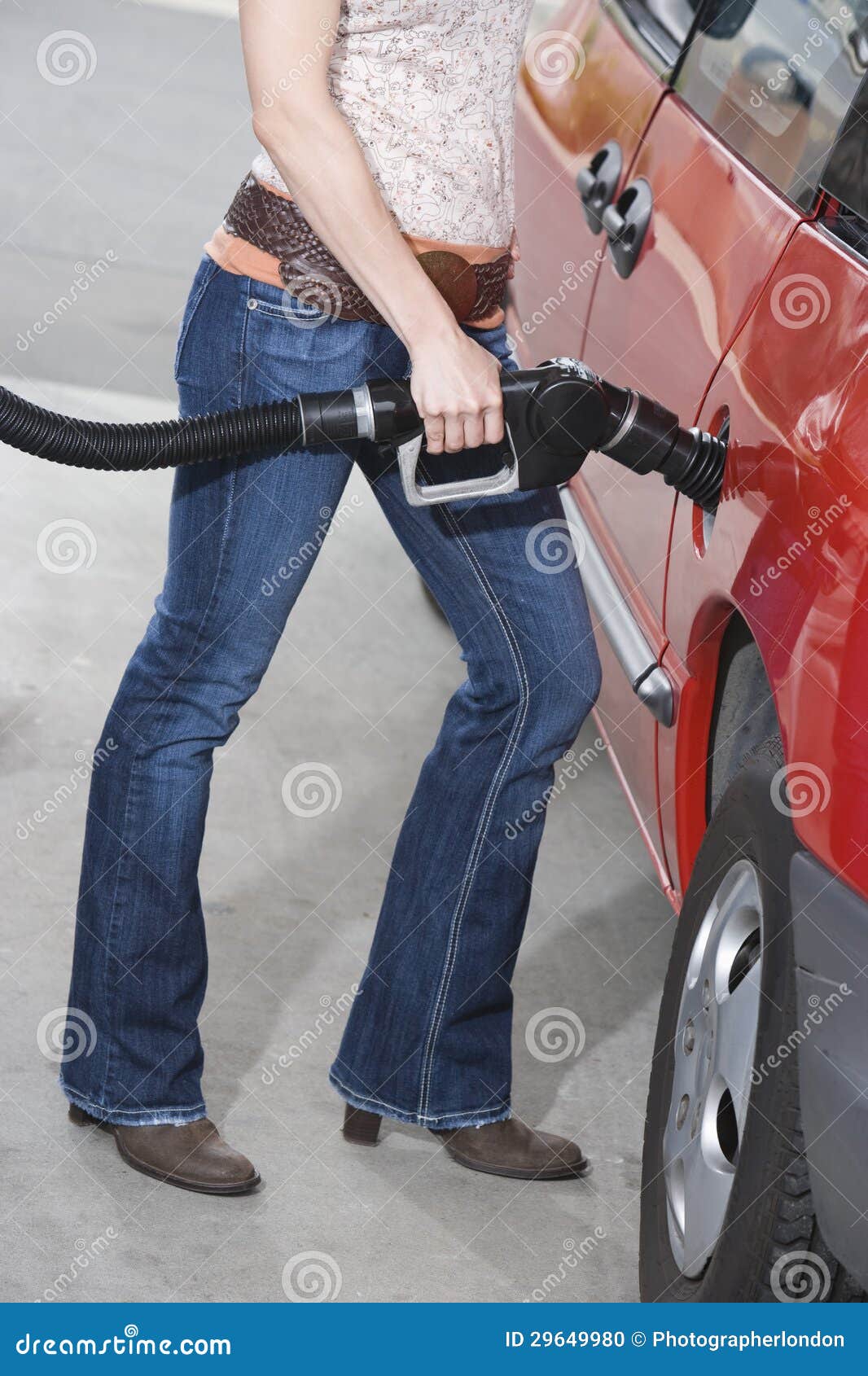 Woman Refueling Her Red Car at a Service Station Stock Photo - Image of ...