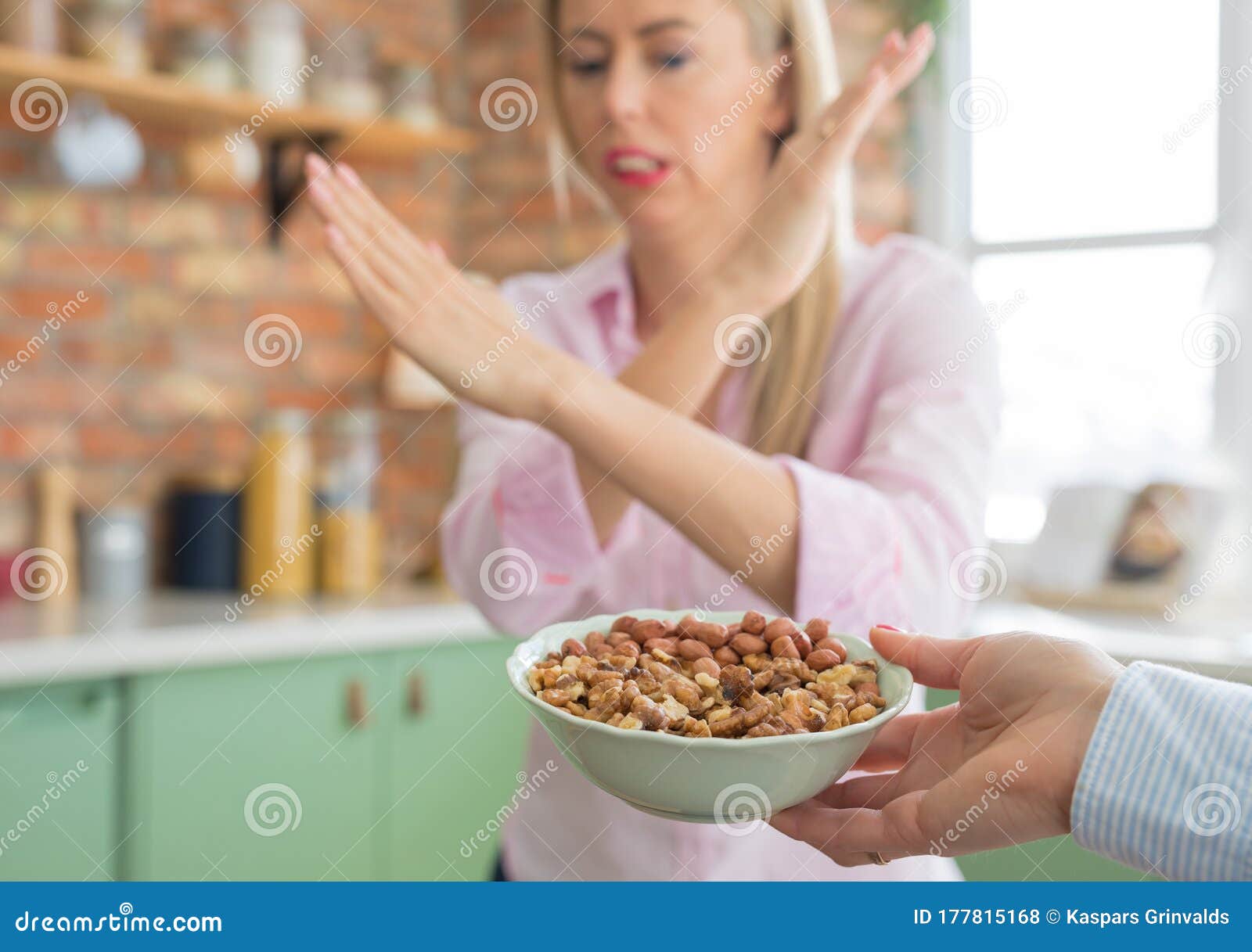 Woman refusing to eat nuts stock photo. Image of diet - 177815168