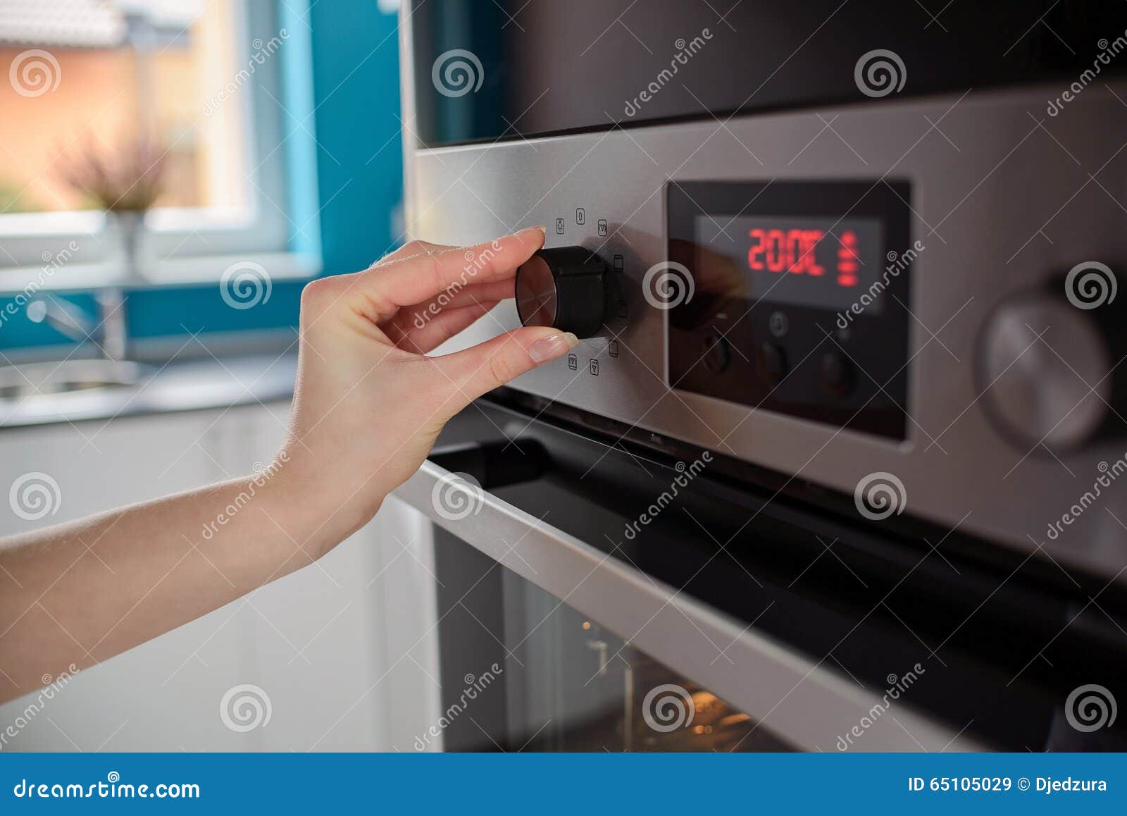 Woman Regulates the Temperature of the Oven Stock Image - Image of ...