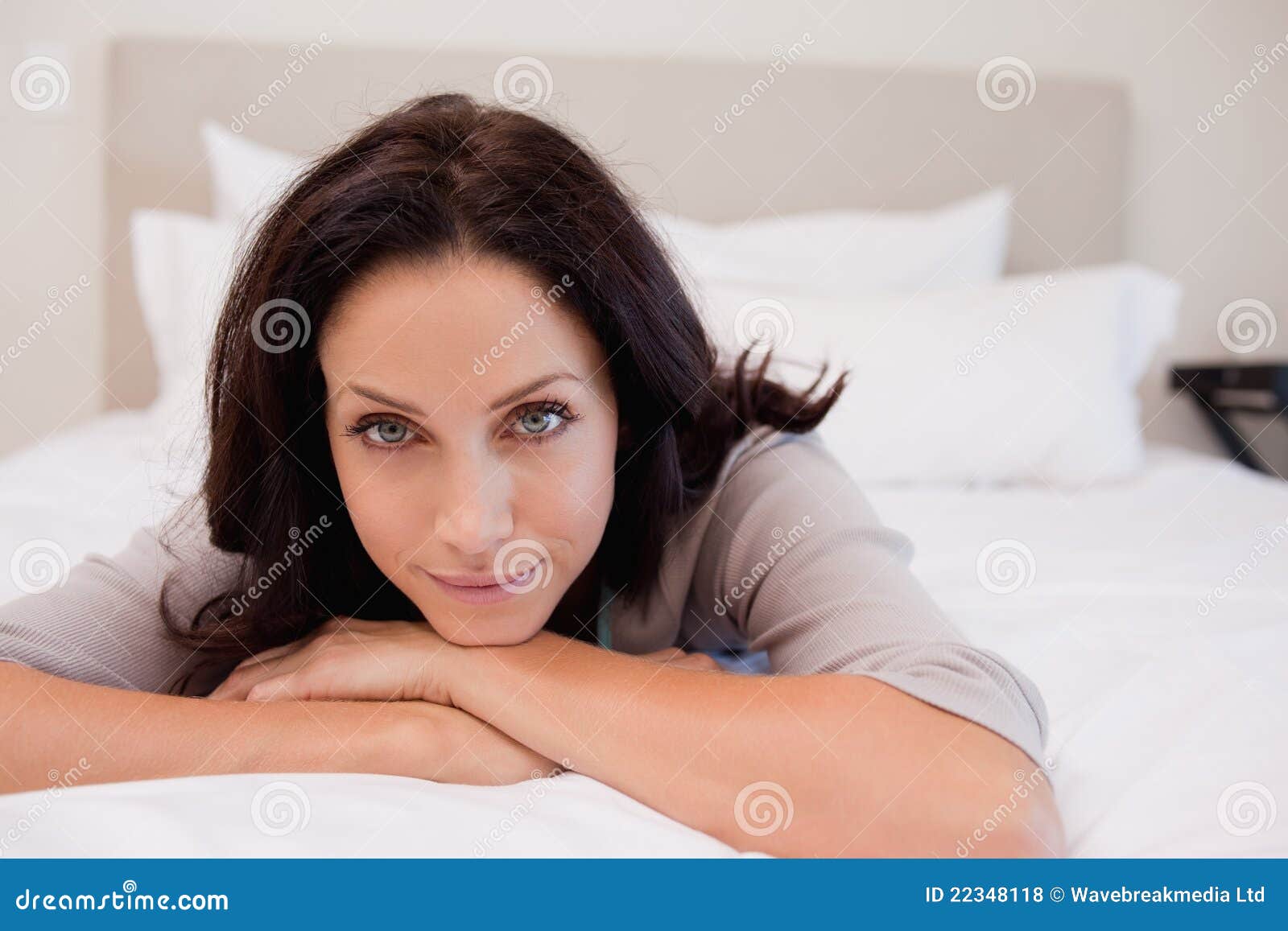 Woman relaxing on the bed stock photo. Image of rest - 22348118