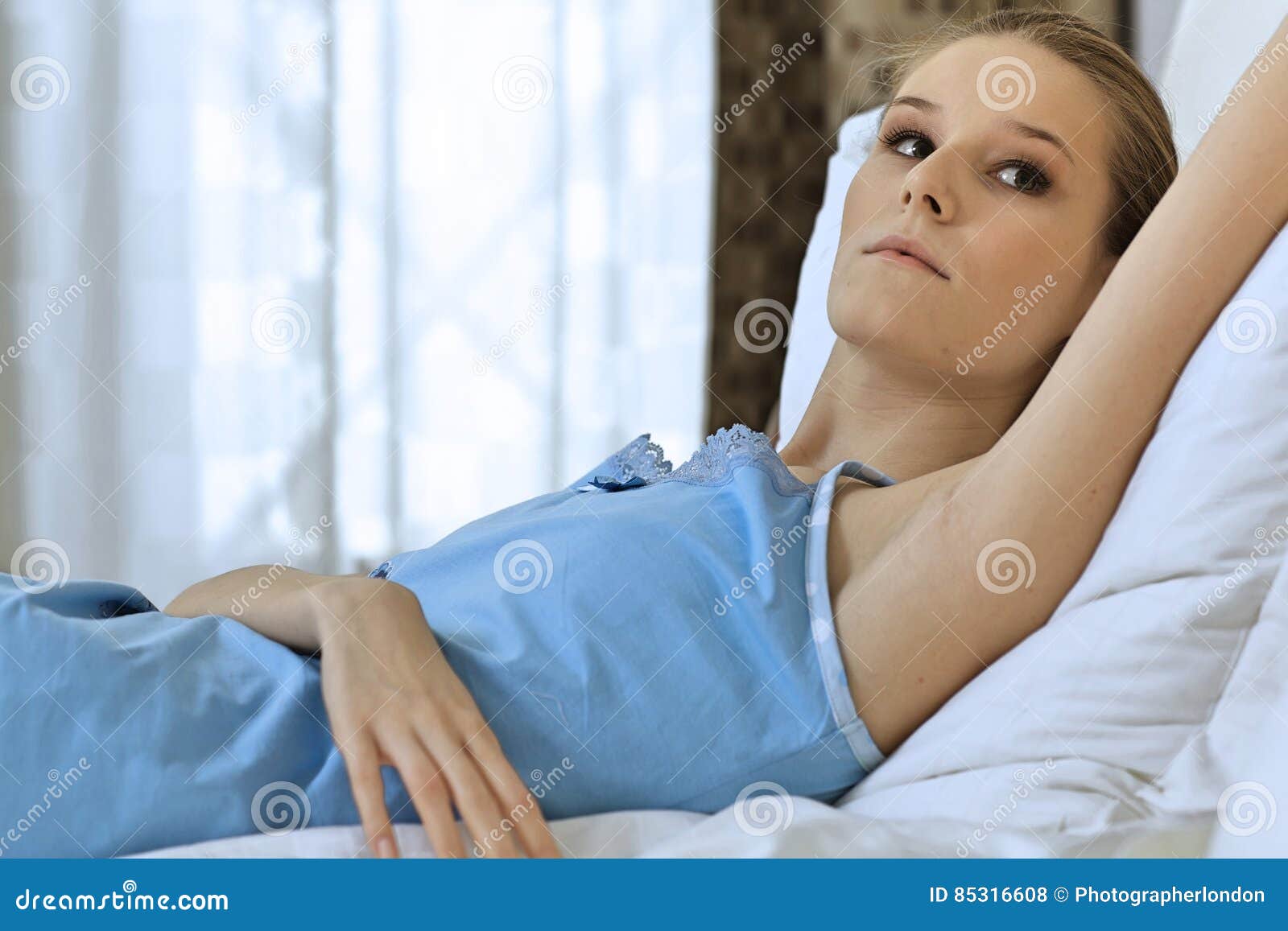 Woman relaxing in bed stock photo. Image of people, alone - 85316608