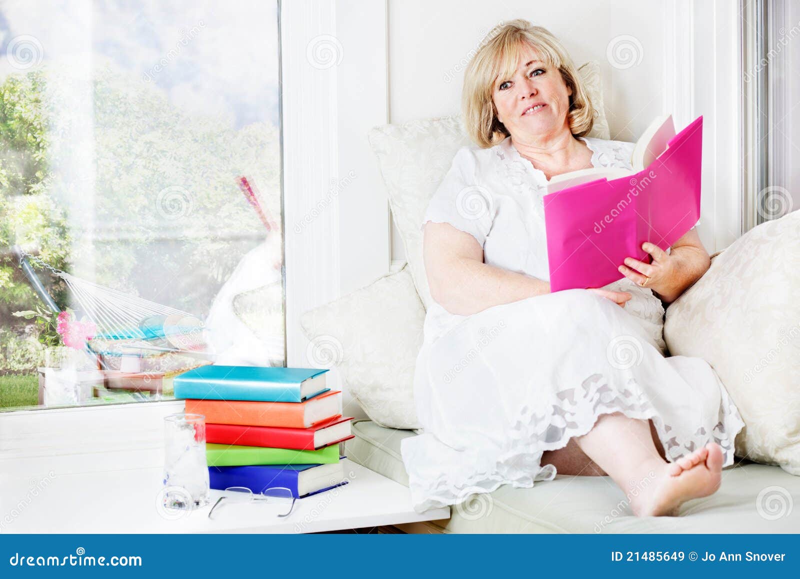 Woman relaxing with books stock image. Image of caucasian - 21485649