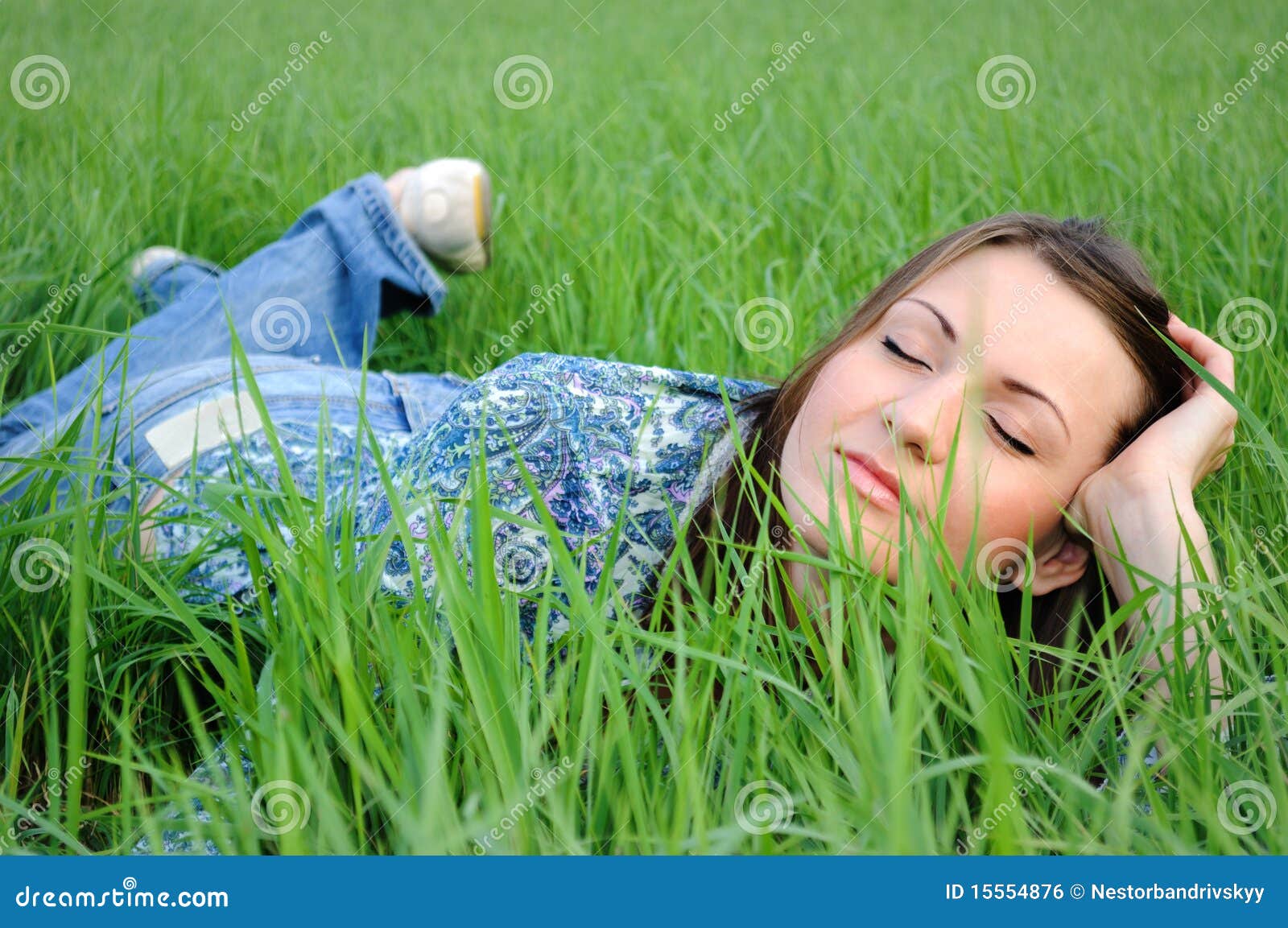 Woman relaxing in field stock photo. Image of green, closed - 15554876
