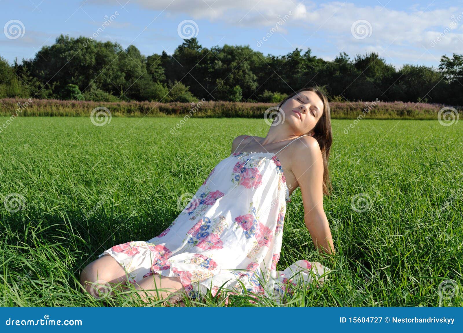 Woman relaxing on field stock image. Image of relaxed - 15604727