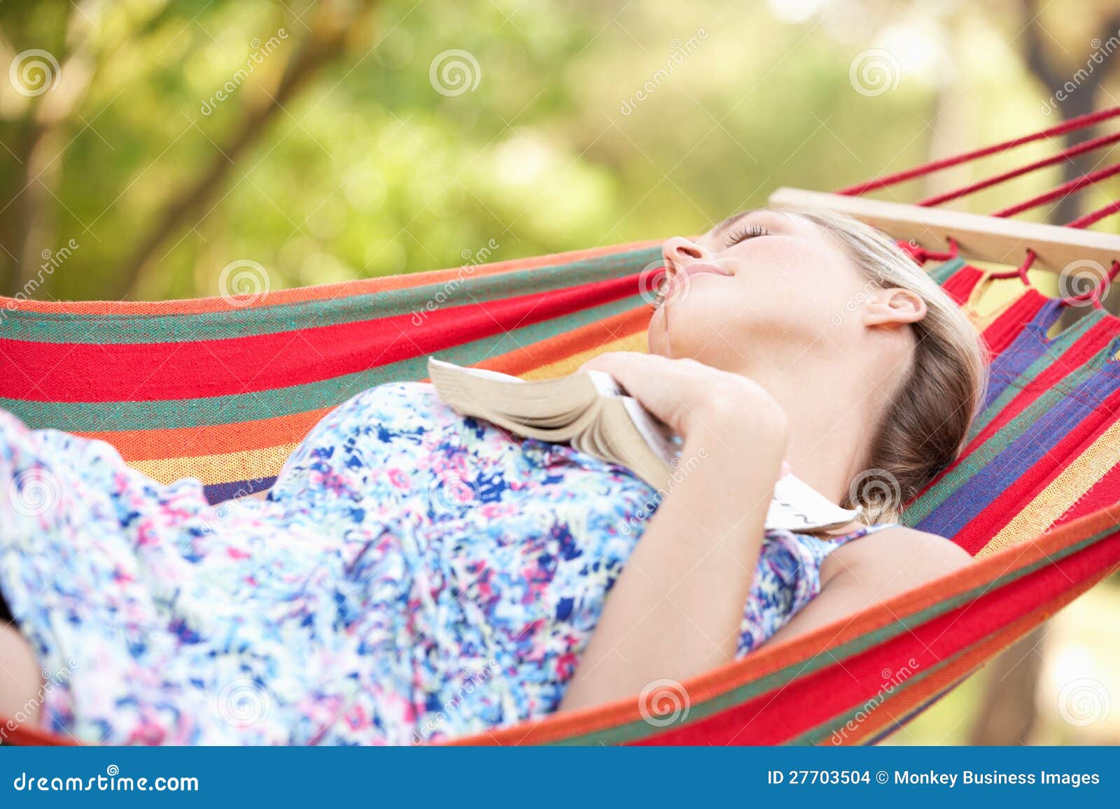 Woman Relaxing in Hammock with Book Stock Photo - Image of garden ...