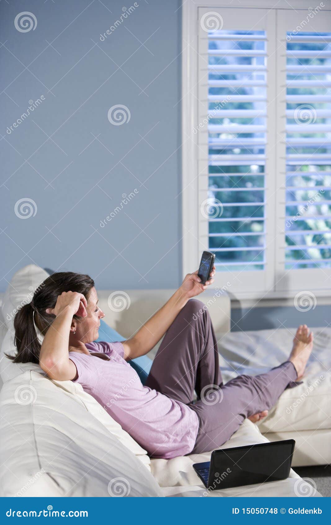 Woman Relaxing and Looking at Text Messages Stock Photo - Image of ...