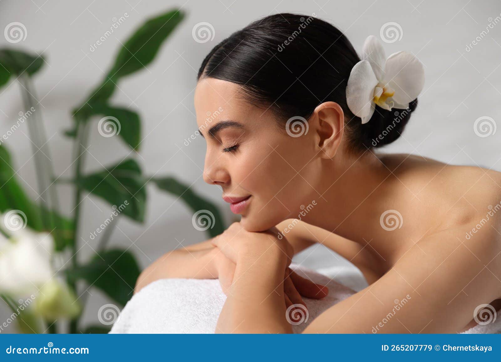 Beautiful Woman Relaxing On Massage Table In Spa Salon Stock Image