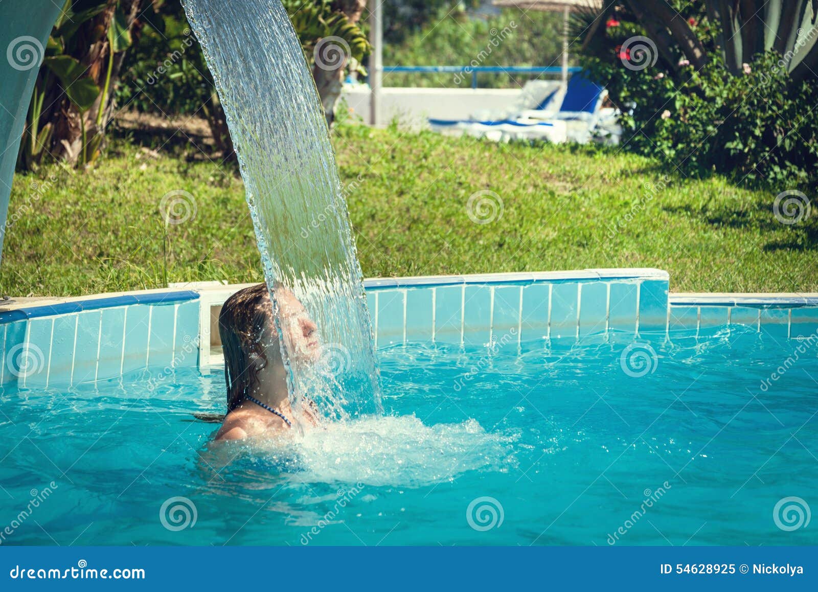 Woman relaxing at the pool stock image. Image of relaxation - 54628925
