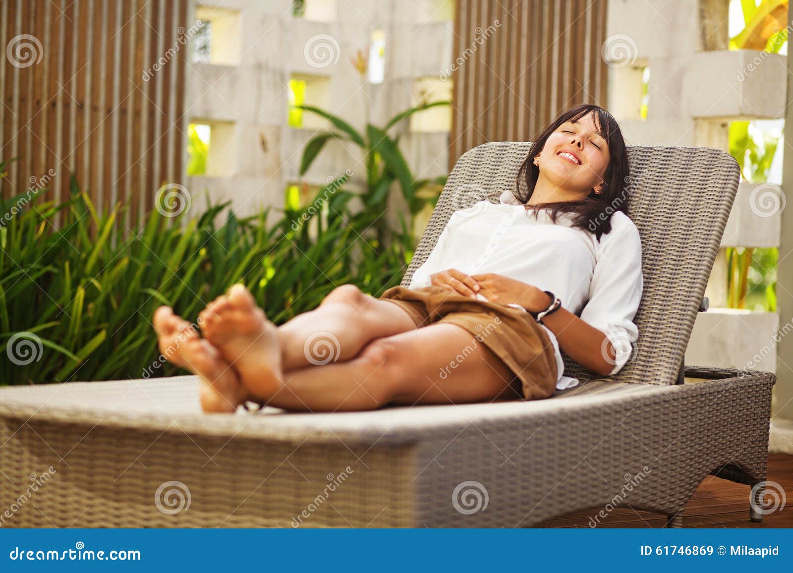 Woman relaxing at resort stock image. Image of green - 61746869