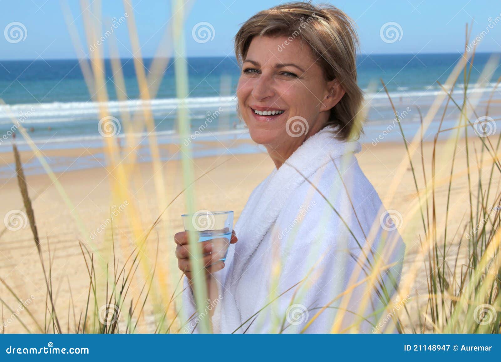 Woman relaxing by the sea stock image. Image of skies - 21148947