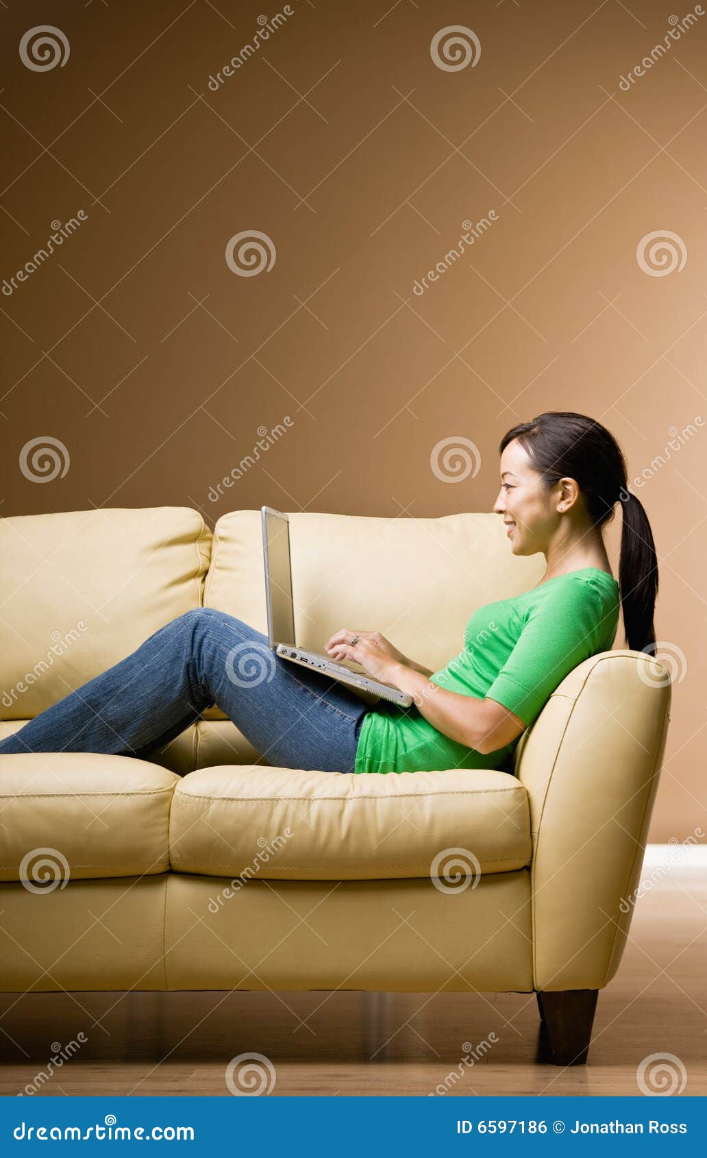 Woman Relaxing on Sofa in Livingroom Stock Photo - Image of lifestyle ...
