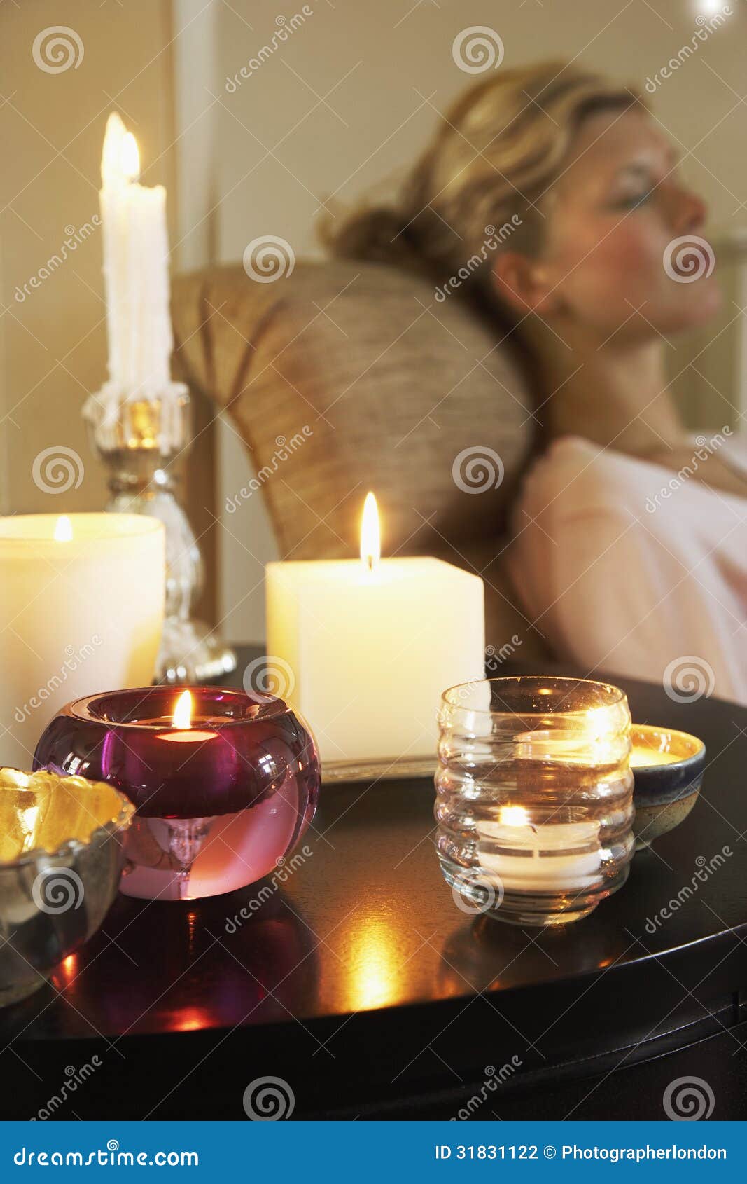 Woman Relaxing by Table with Lit Candles Stock Photo - Image of coffee ...