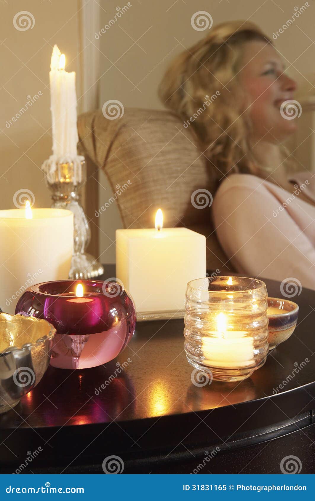 Woman Relaxing by Table with Lit Candles Stock Image - Image of ...