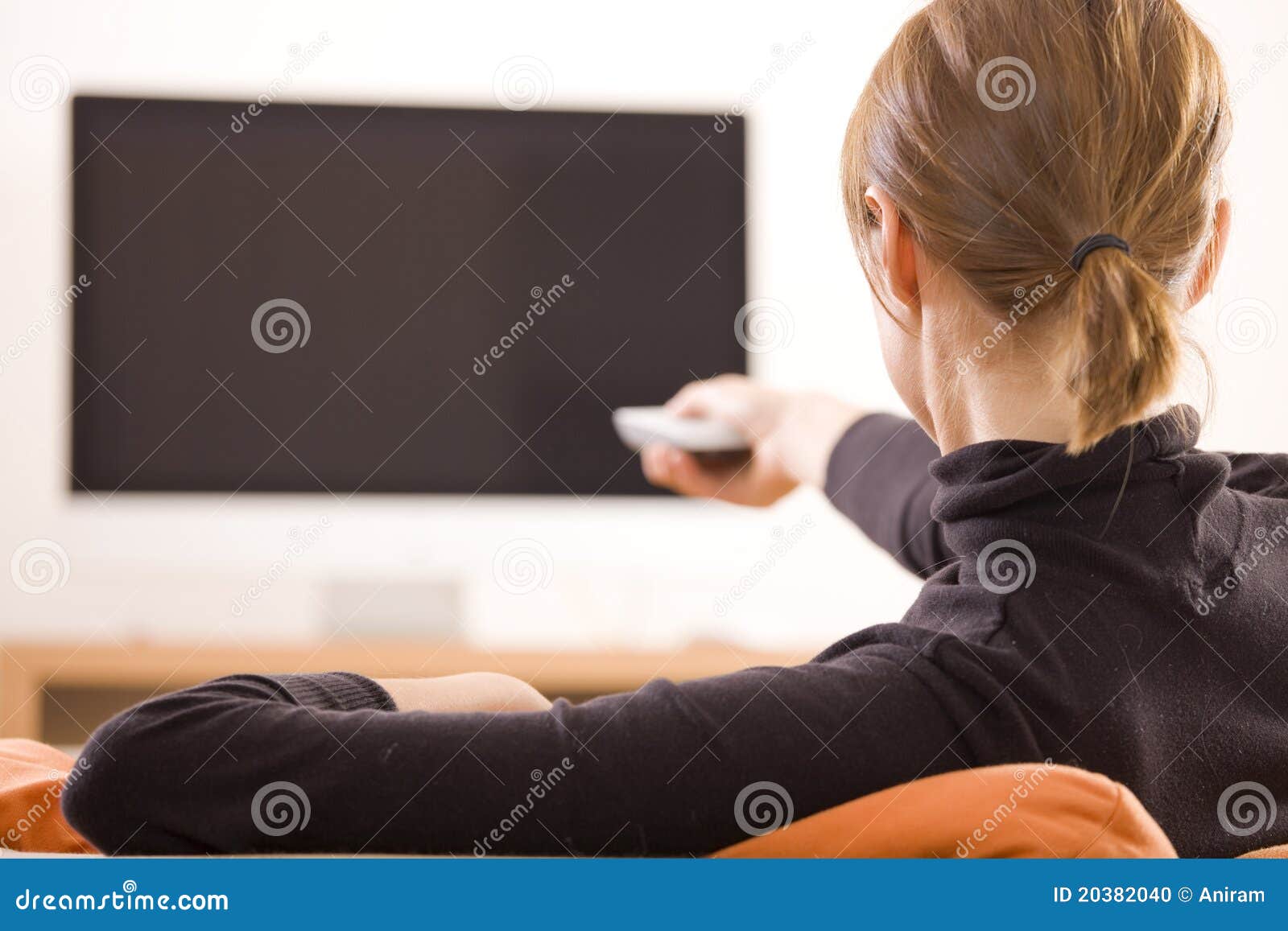 Woman with remote control stock photo. Image of computer - 20382040