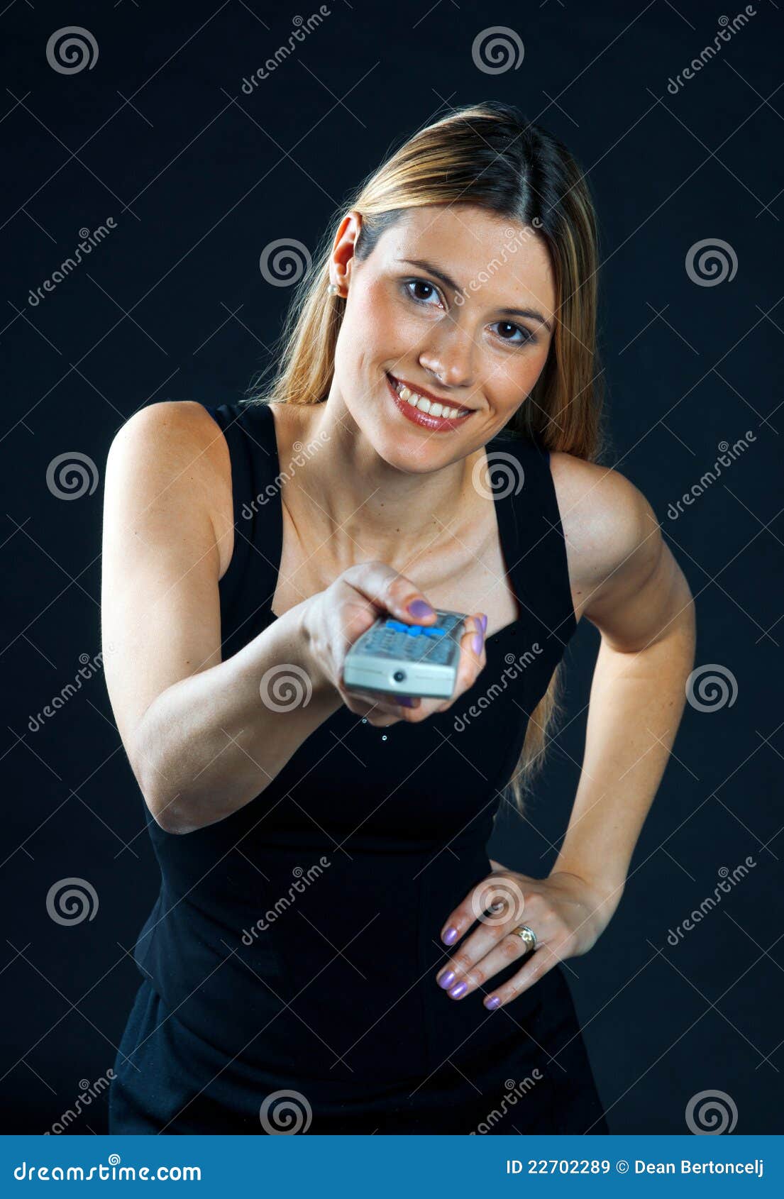 Woman with remote control stock image. Image of communication - 22702289