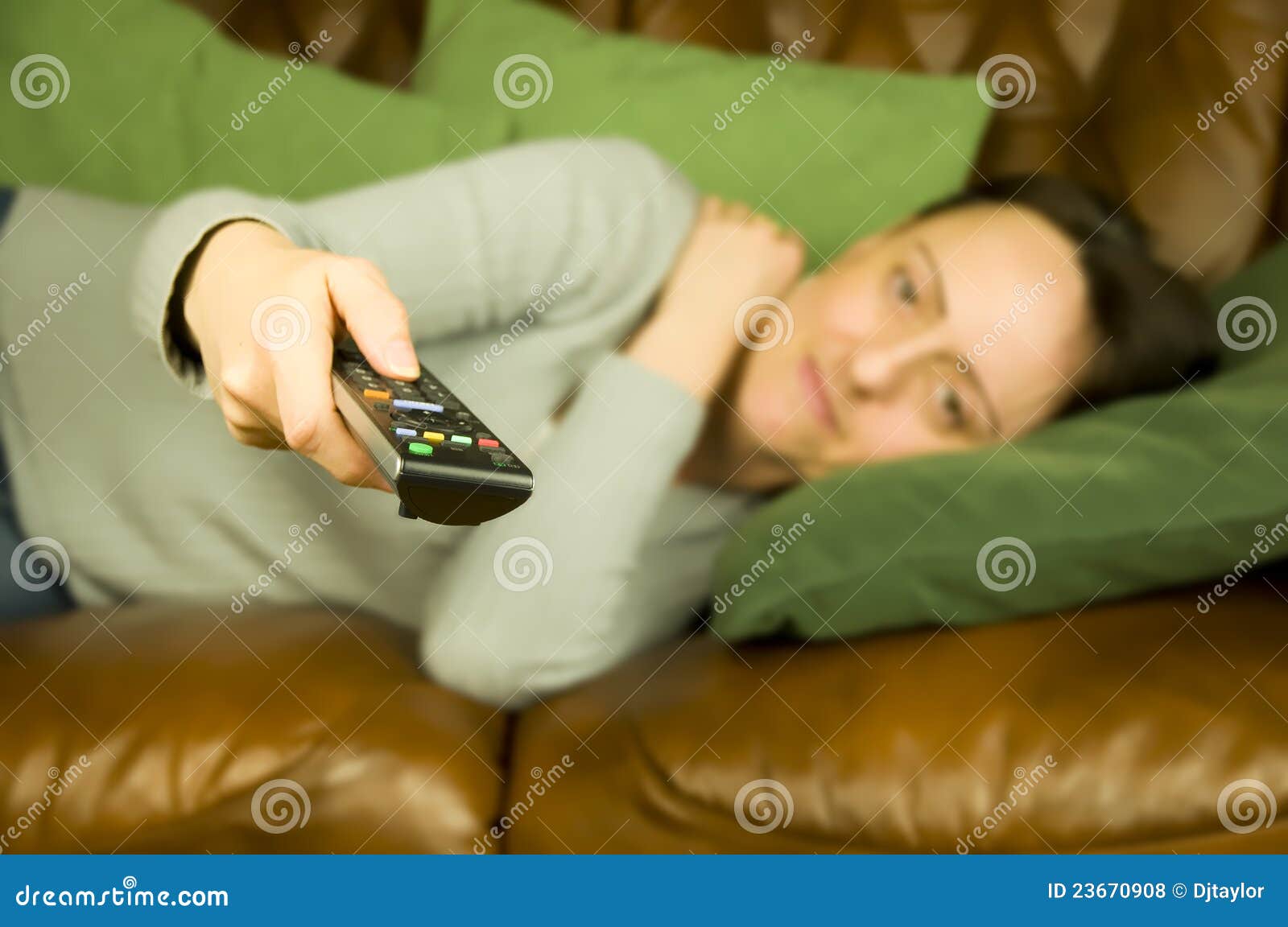 Woman with remote control stock photo. Image of pointing - 23670908
