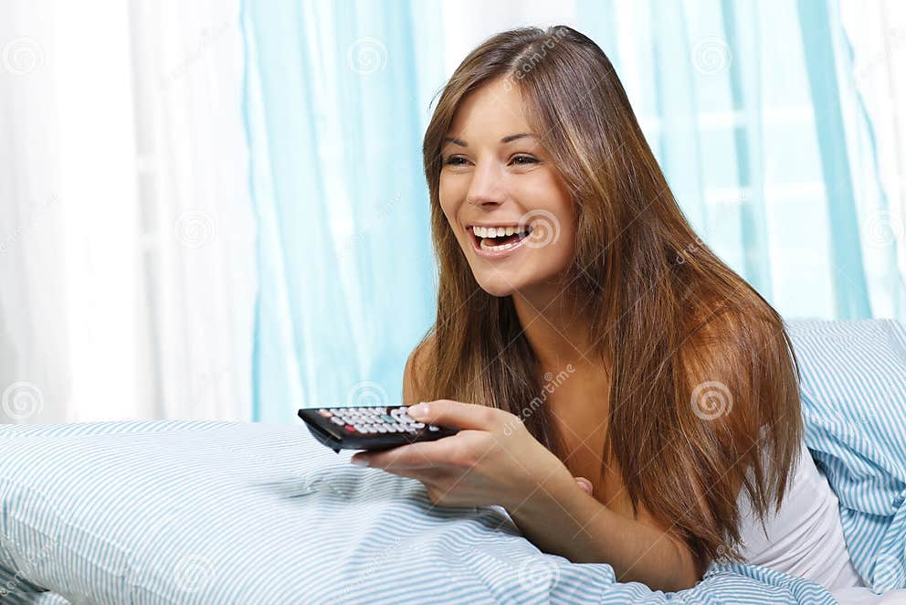 Woman with a Remote Control Stock Image - Image of control, look: 31344609