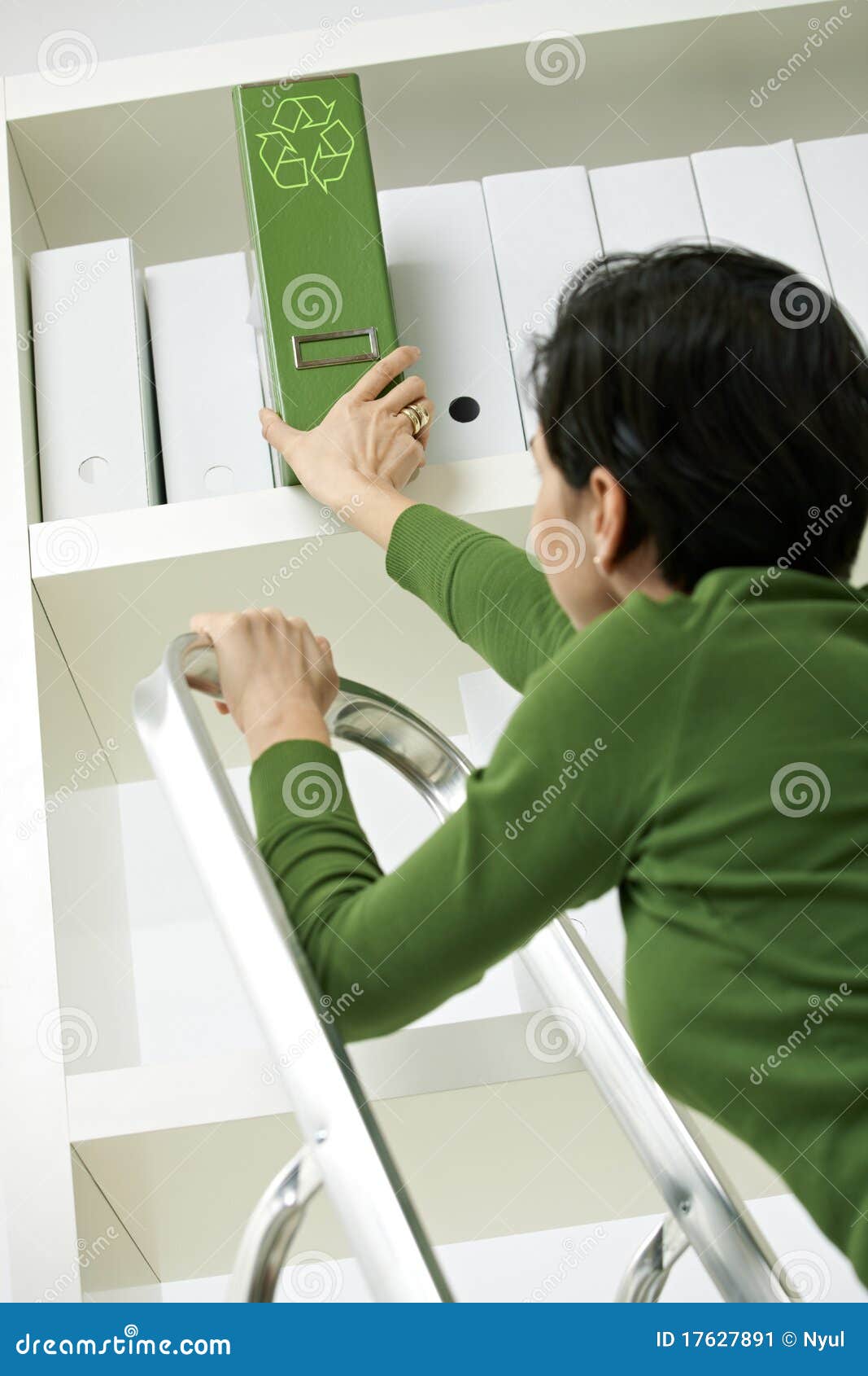 Woman Removing Green Folder from Shelf Stock Image - Image of indoors ...